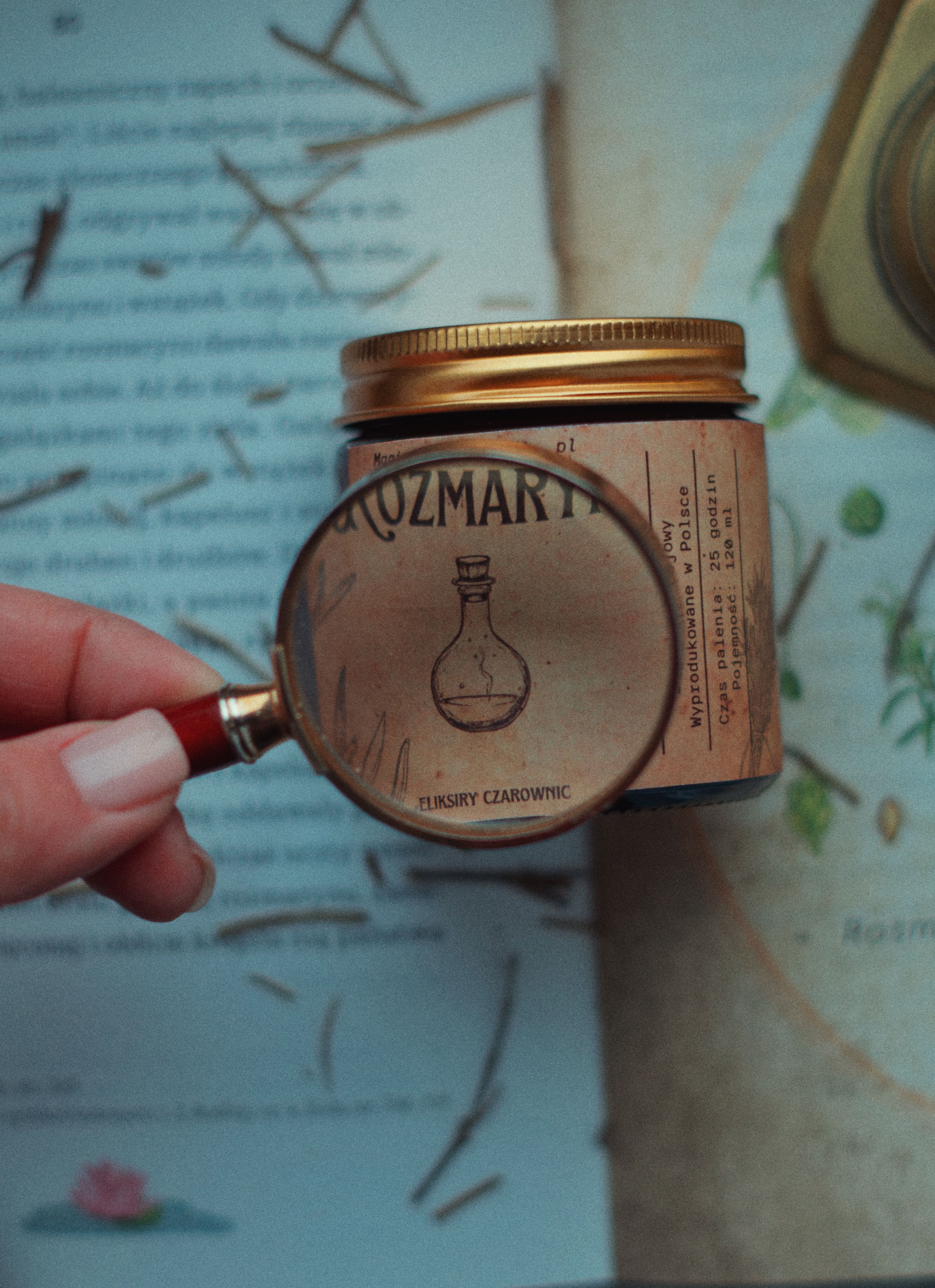 Artistic Still Life with Jar Candle and Magnifying Glass · Free Stock Photo