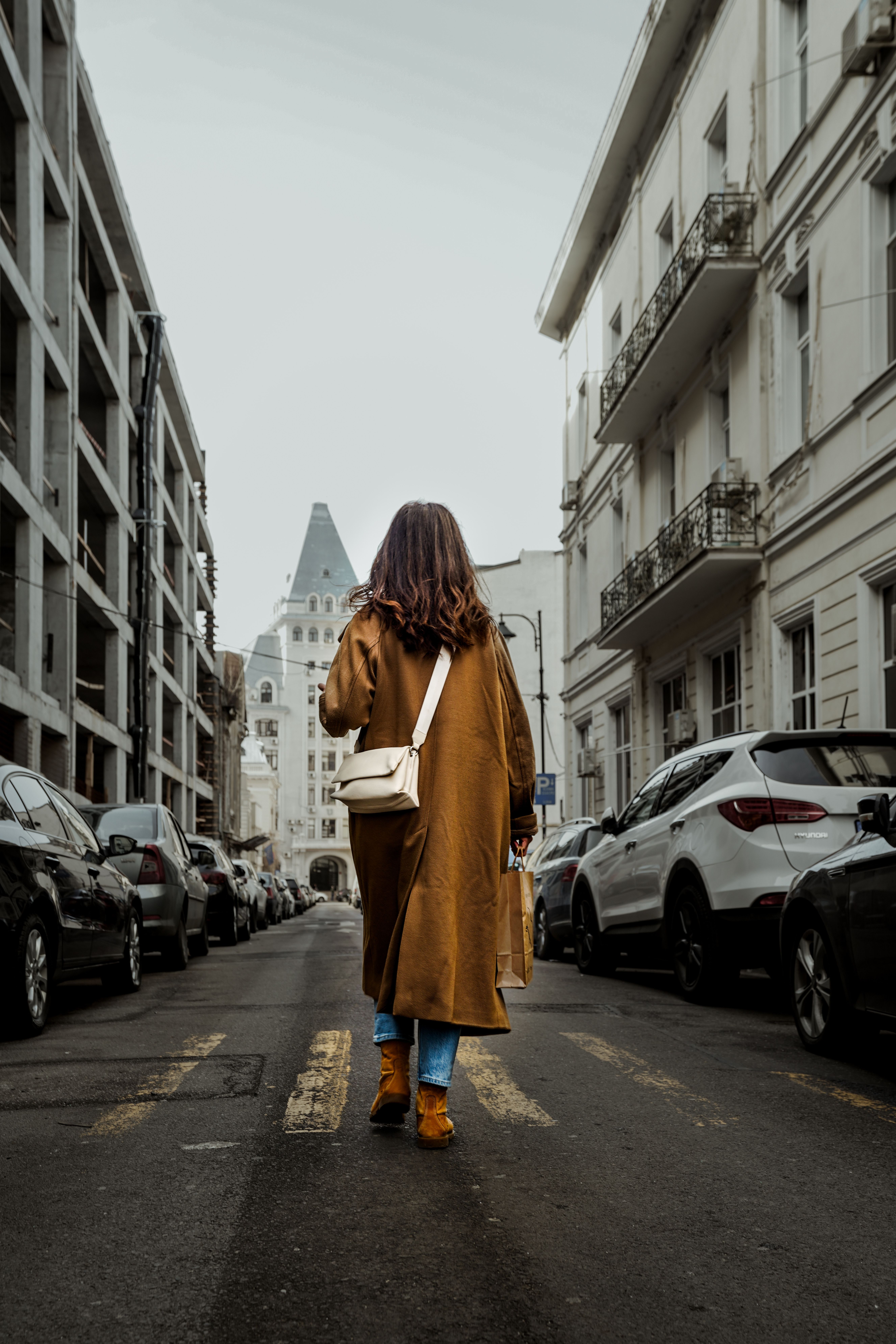 Urban Exploration: Woman Walking in City Street · Free Stock Photo