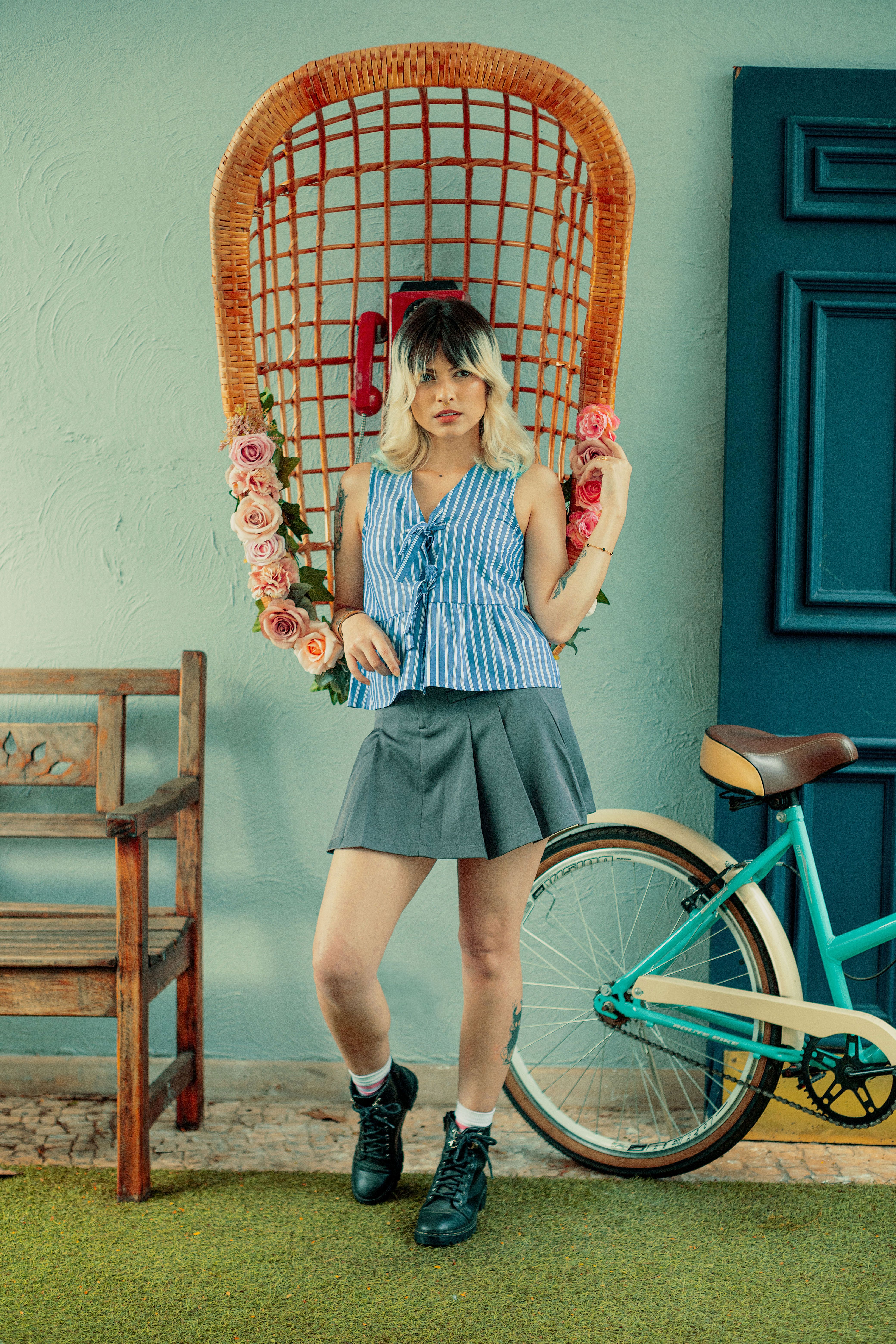 Stylish Woman Posing with Bicycle Indoors · Free Stock Photo