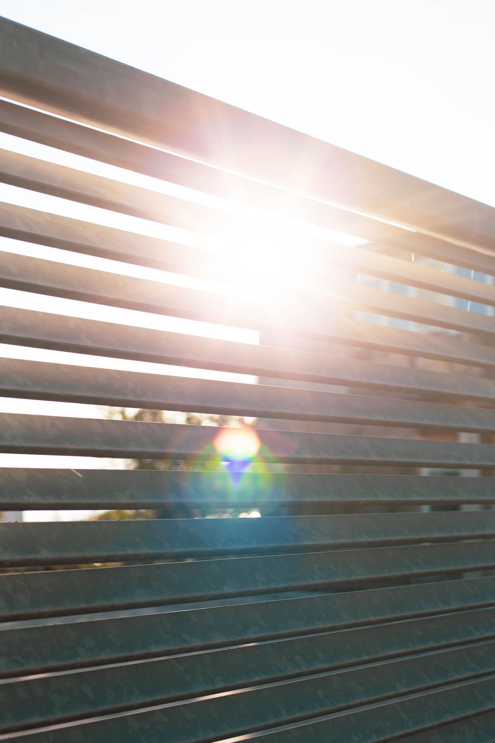 Sunlight Streaming Through Metal Slats · Free Stock Photo