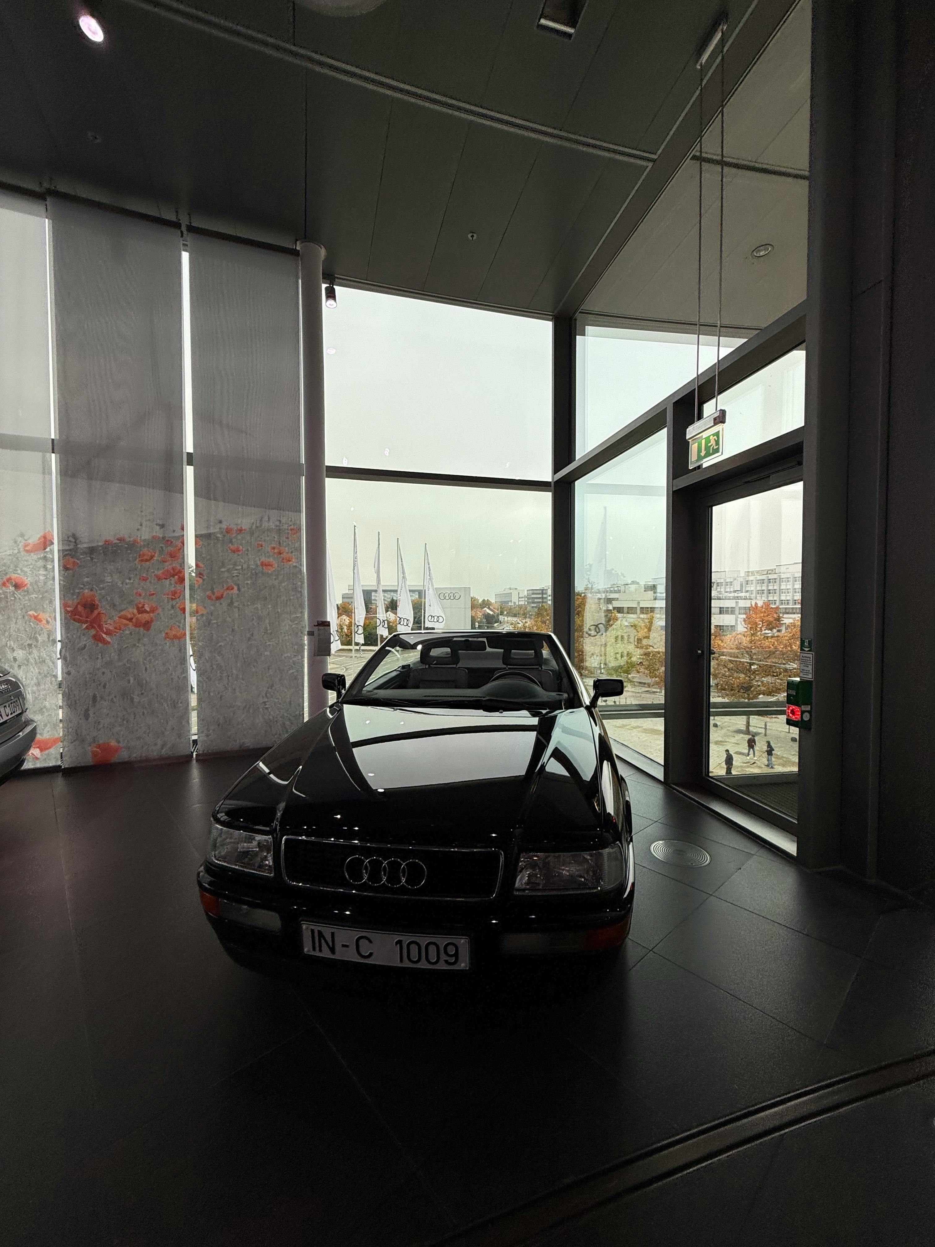 Luxury Car Display in Modern Showroom · Free Stock Photo