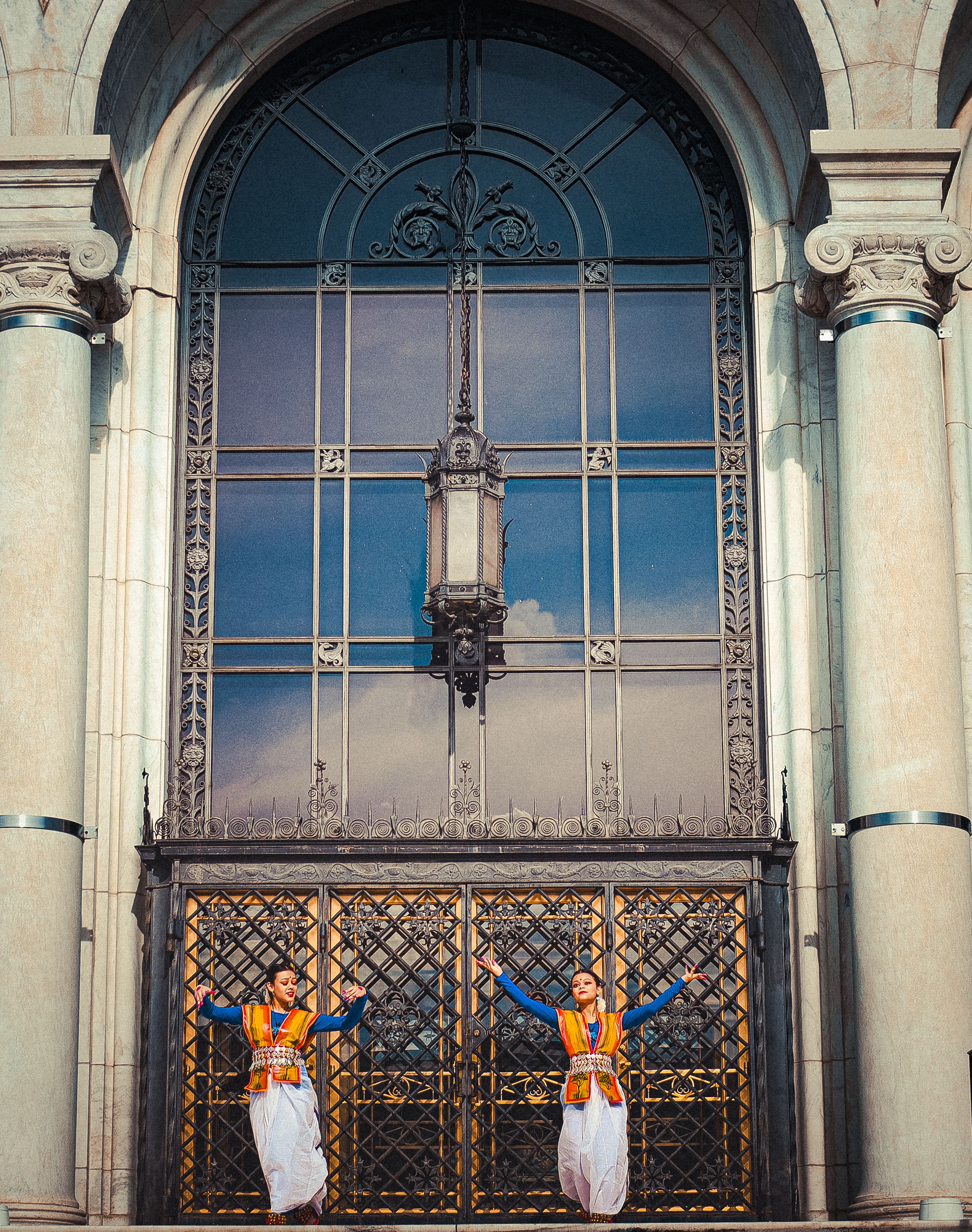 Traditional Dancers at Historic Architectural Entrance · Free Stock Photo