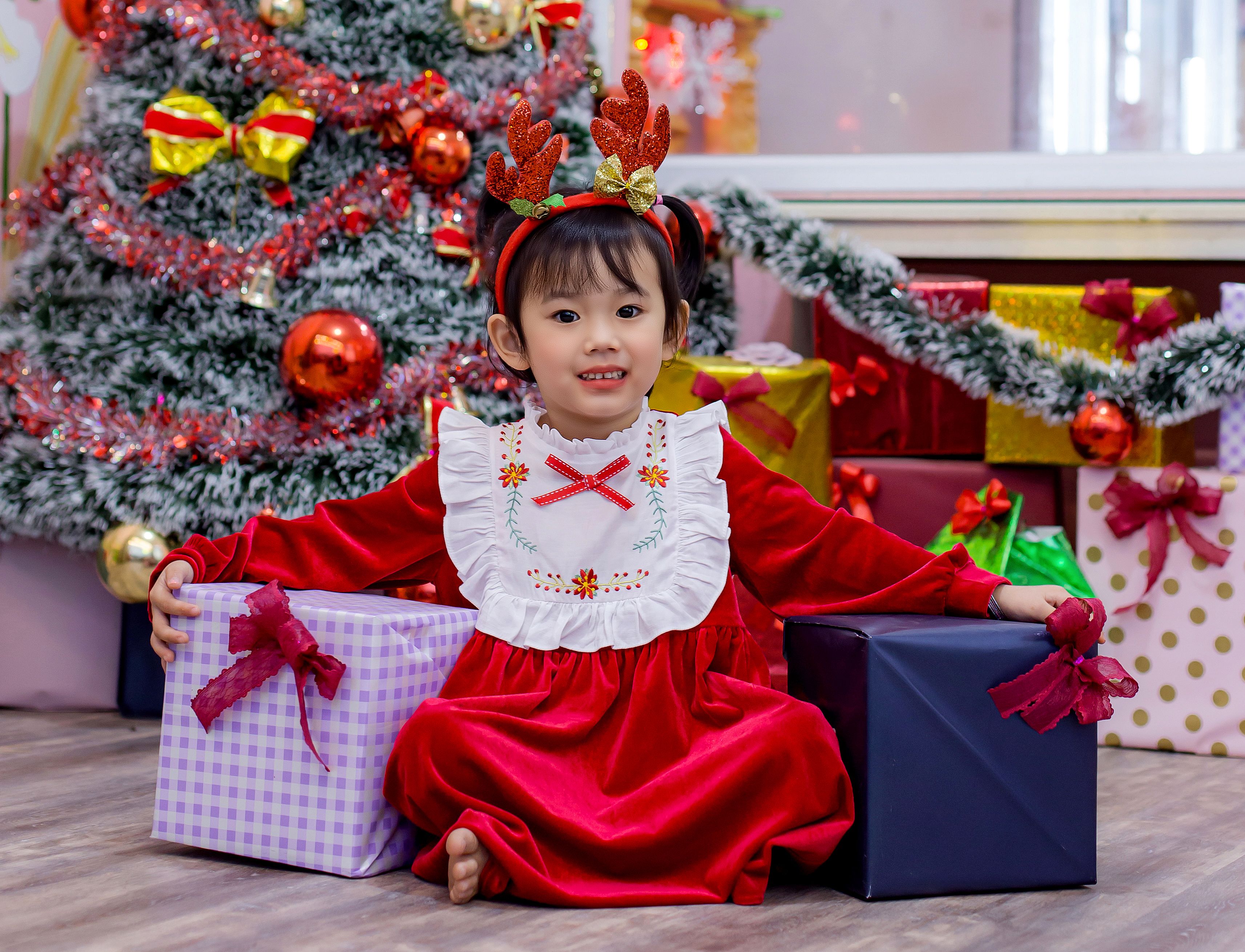 Festive Christmas Portrait of a Smiling Child · Free Stock Photo