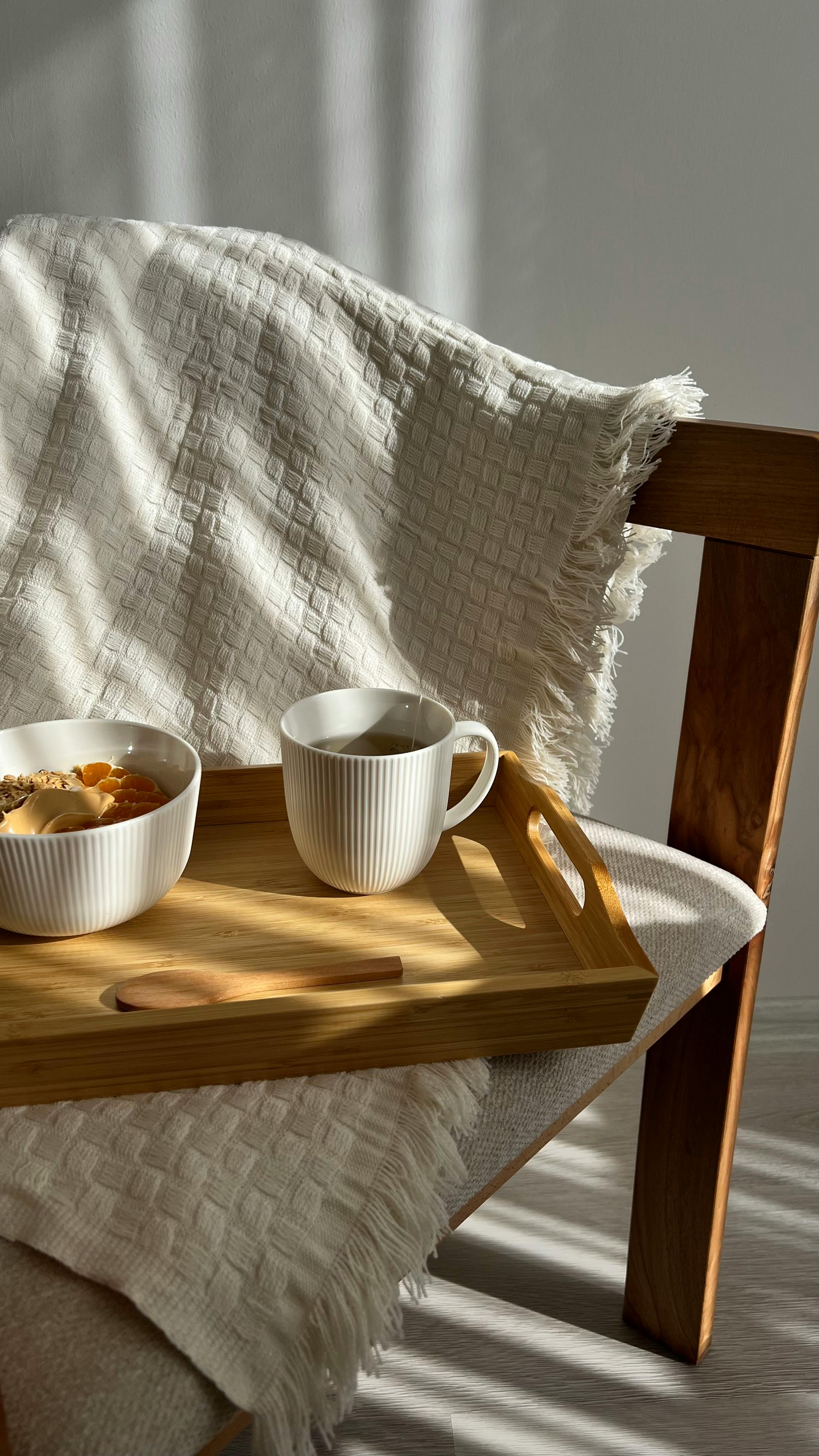Cozy morning setup with breakfast on rustic chair · Free Stock Photo