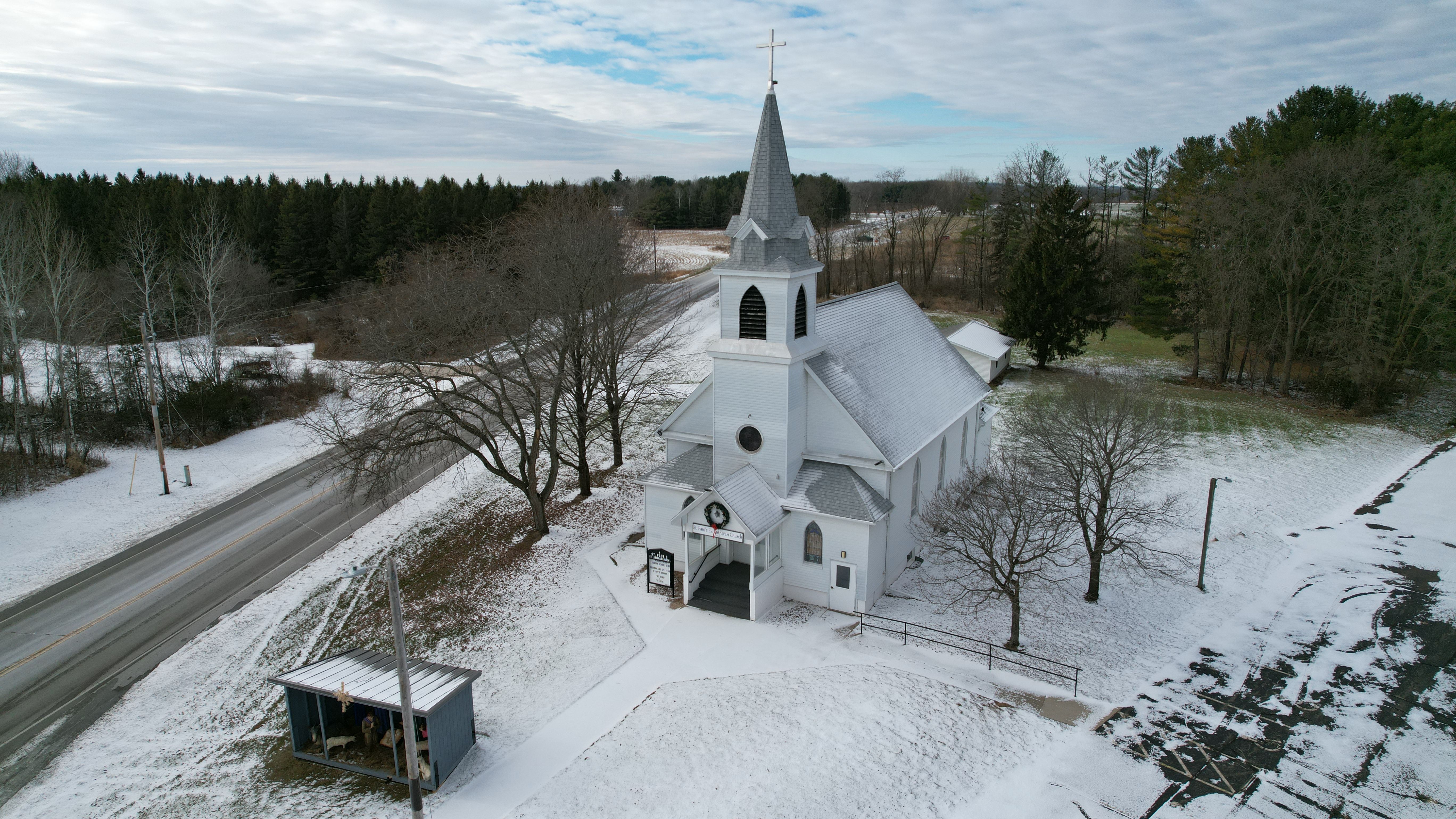 Aerial view of snow-covered rural church · Free Stock Photo
