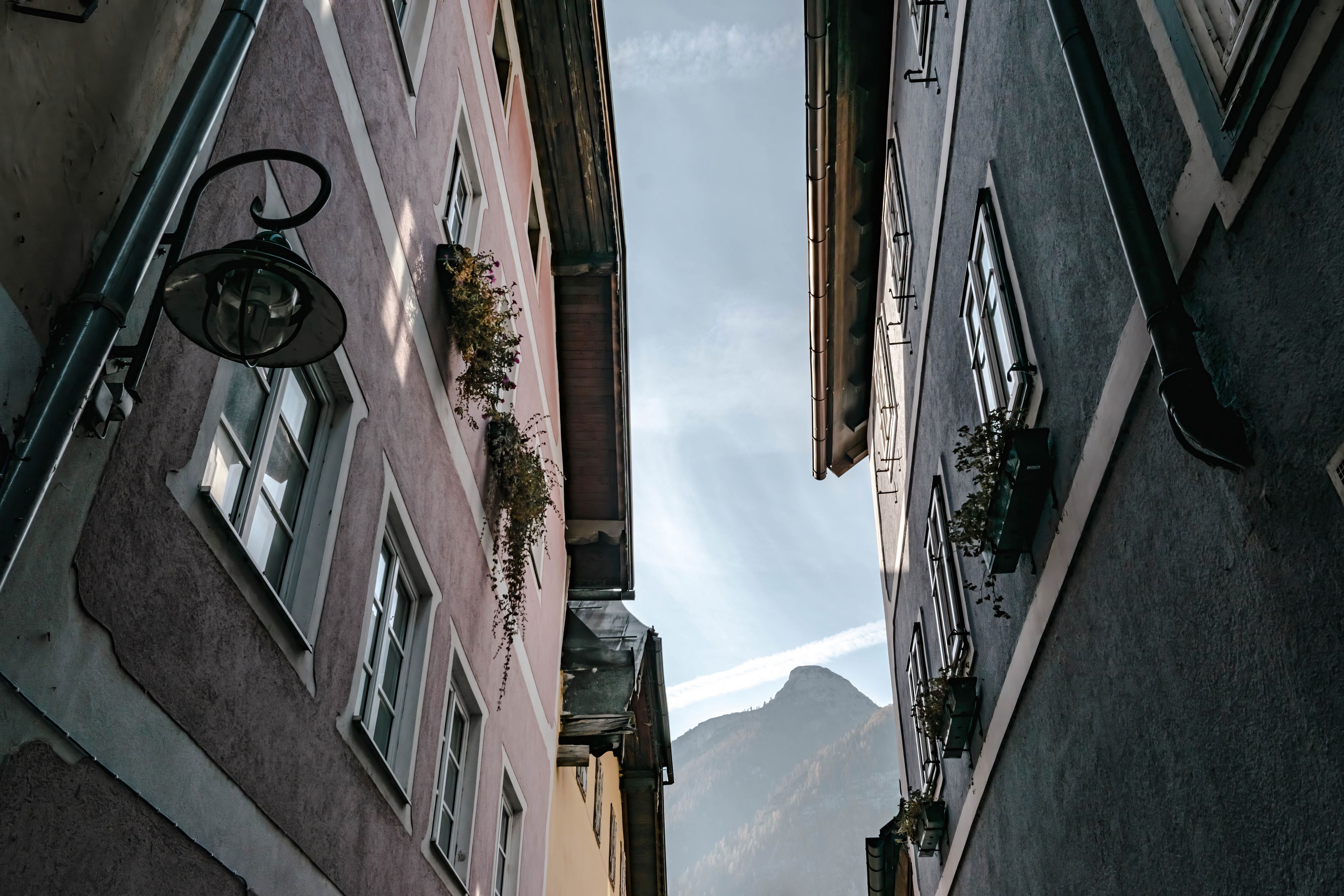 Charming Architectural Alley with Mountain View · Free Stock Photo