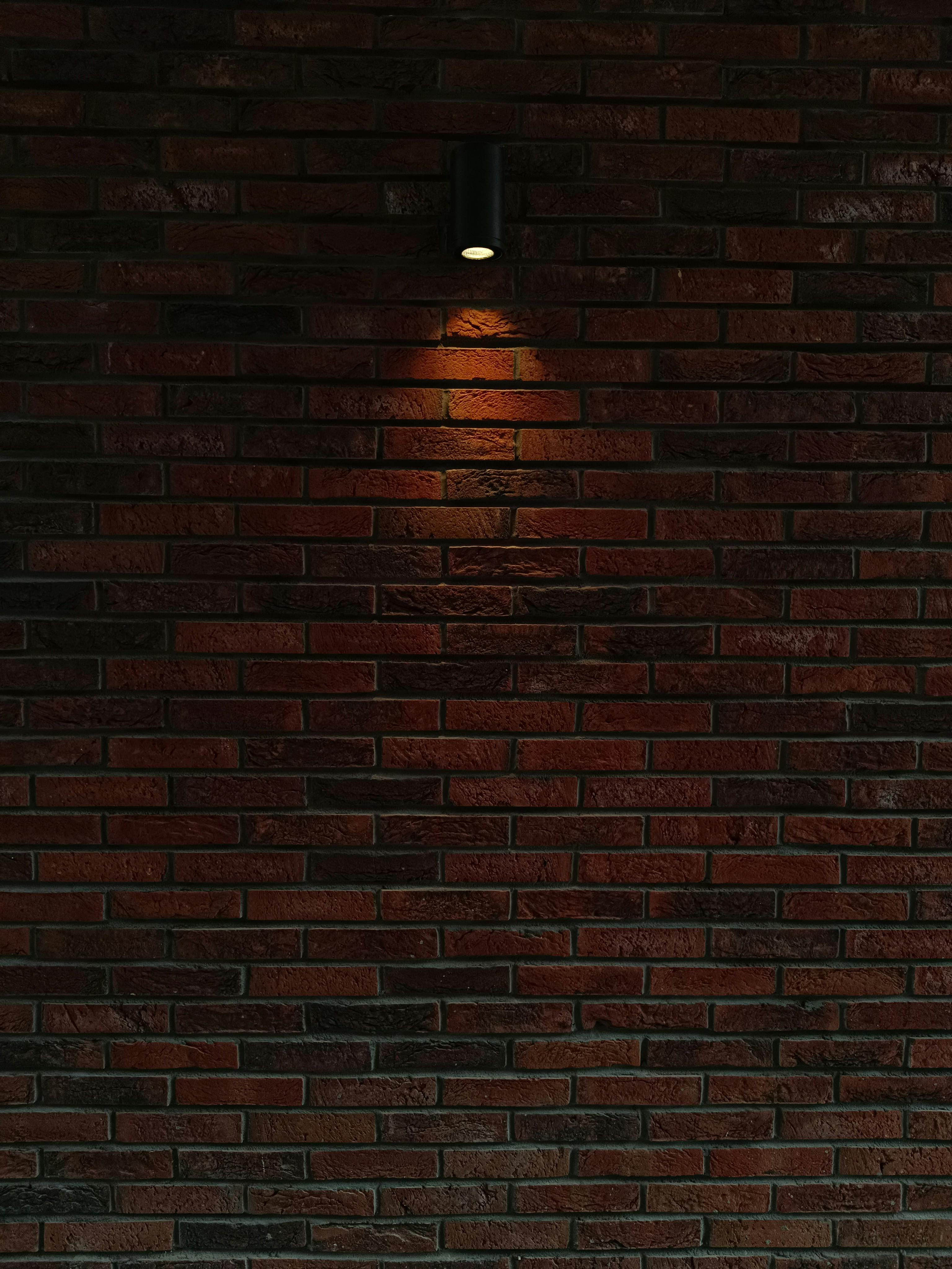 Moody Brick Wall with Spot Lighting · Free Stock Photo