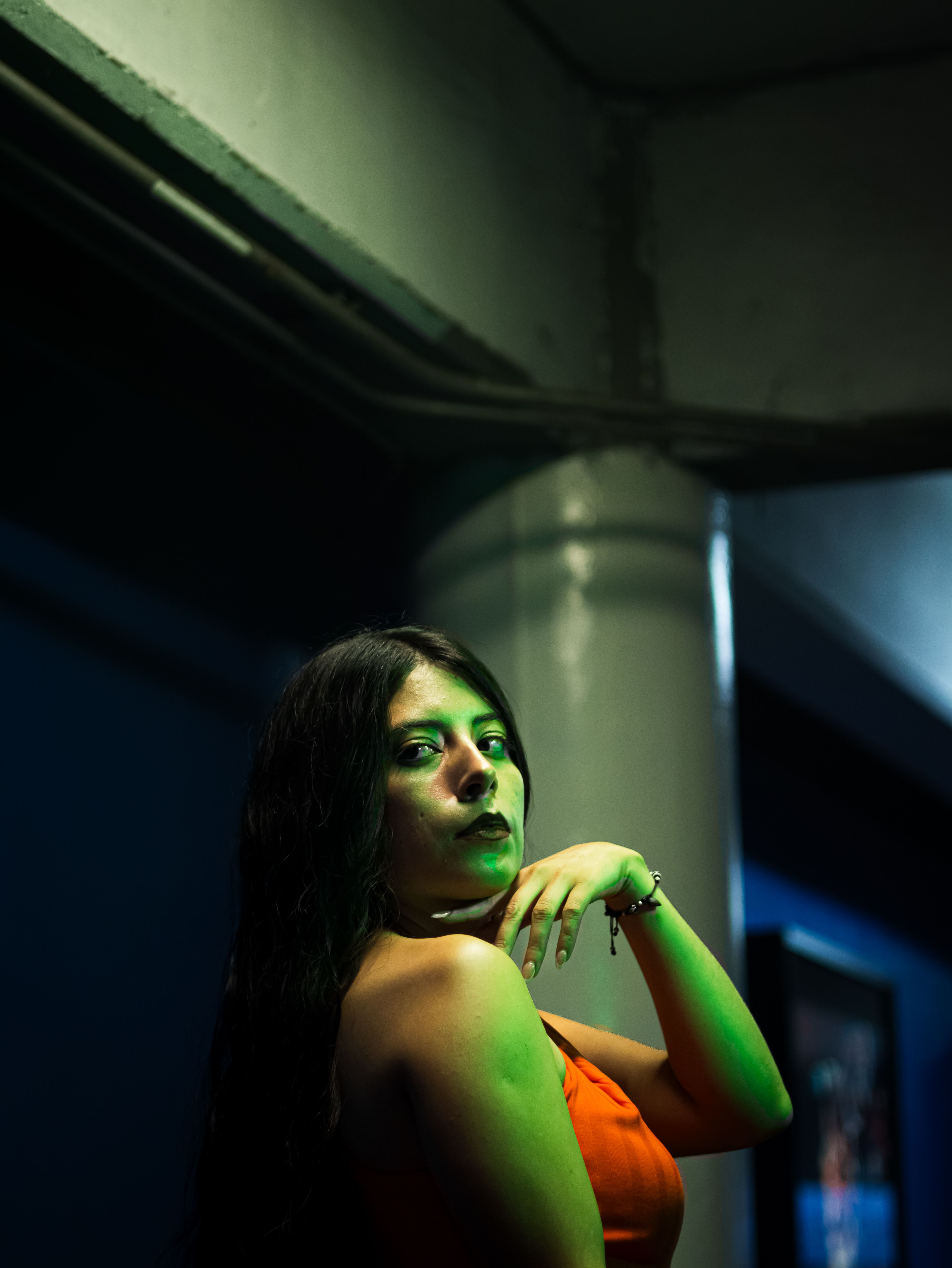 Moody Portrait of Woman in Dimly Lit Interior · Free Stock Photo