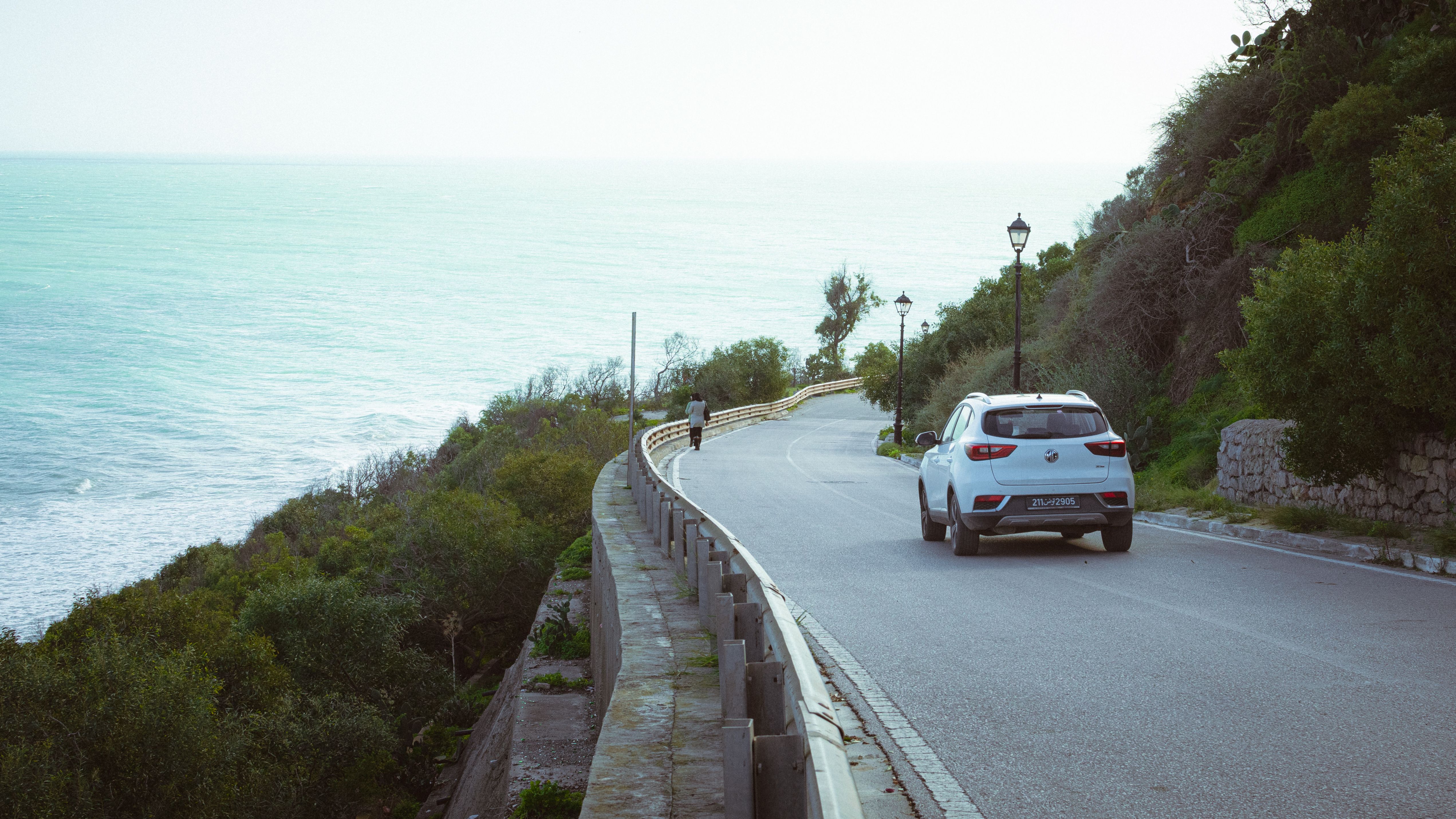 Coastal Road with Car and Scenic Ocean View in Carthage · Free Stock Photo