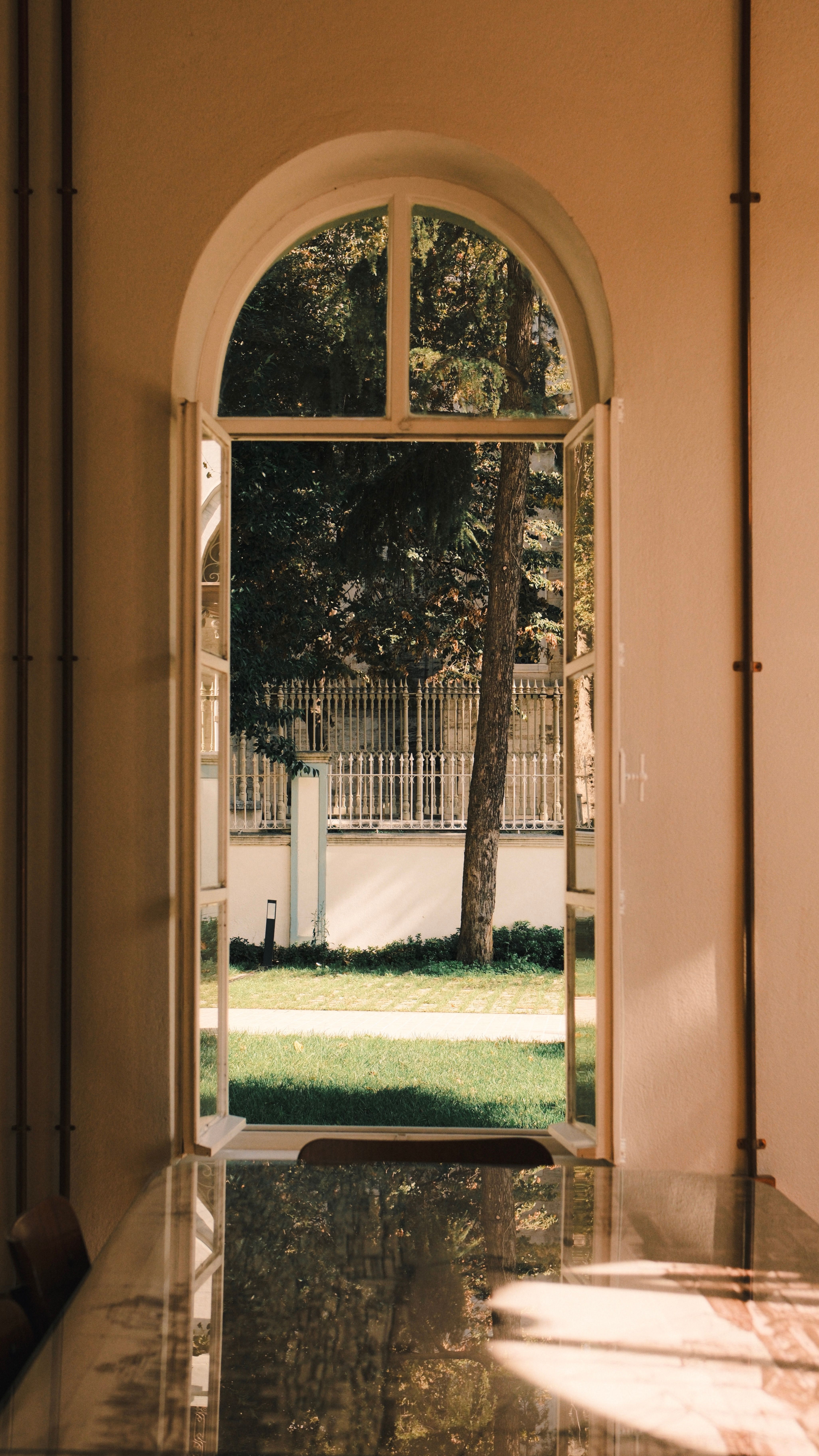 Elegant Arched Doorway Overlooking Tranquil Garden · Free Stock Photo