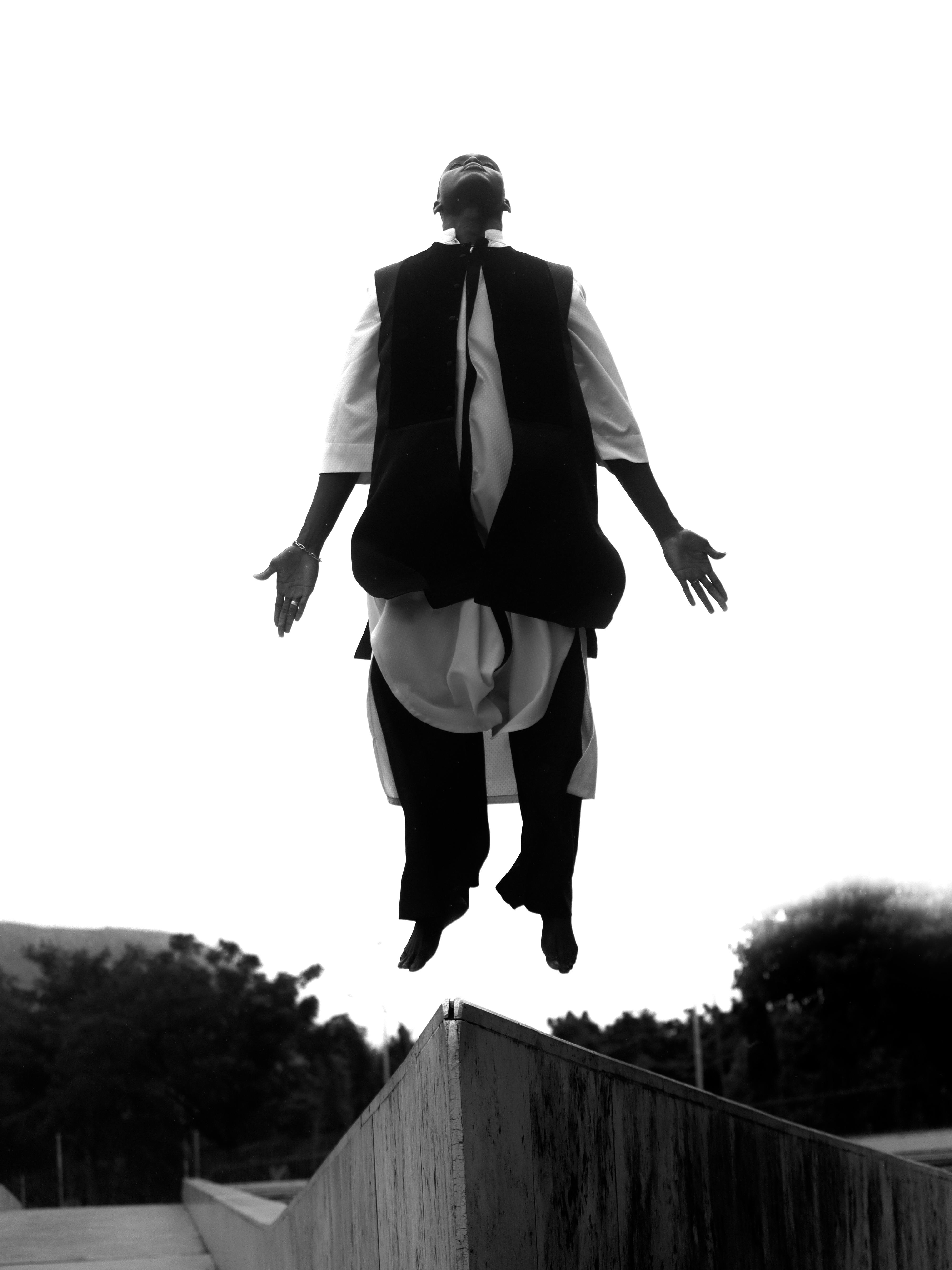 Artistic Black and White Fashion Jump Portrait · Free Stock Photo