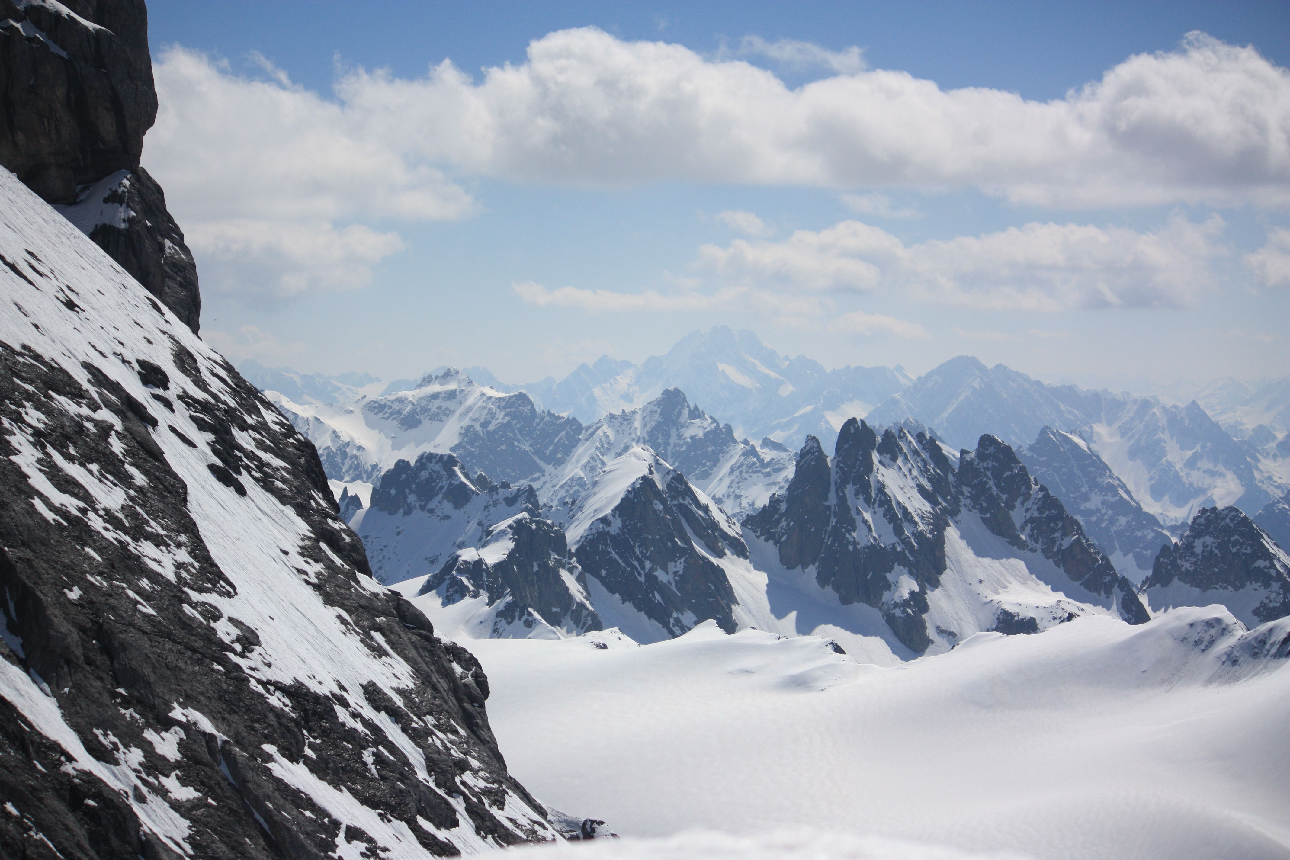Snowy Mountain Peaks Under Blue Sky · Free Stock Photo
