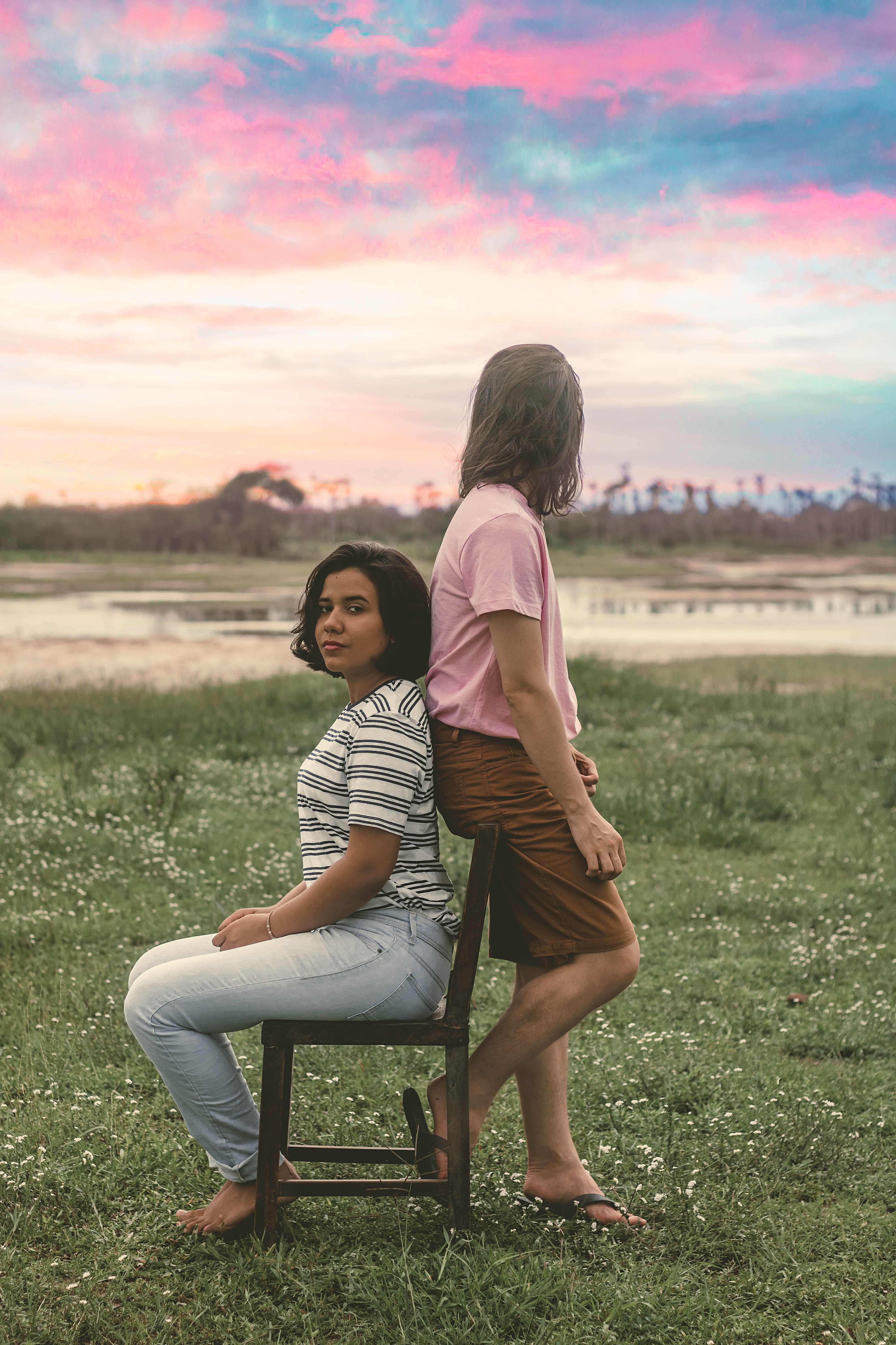 Diverse women during colorful sunset in countryside · Free Stock Photo