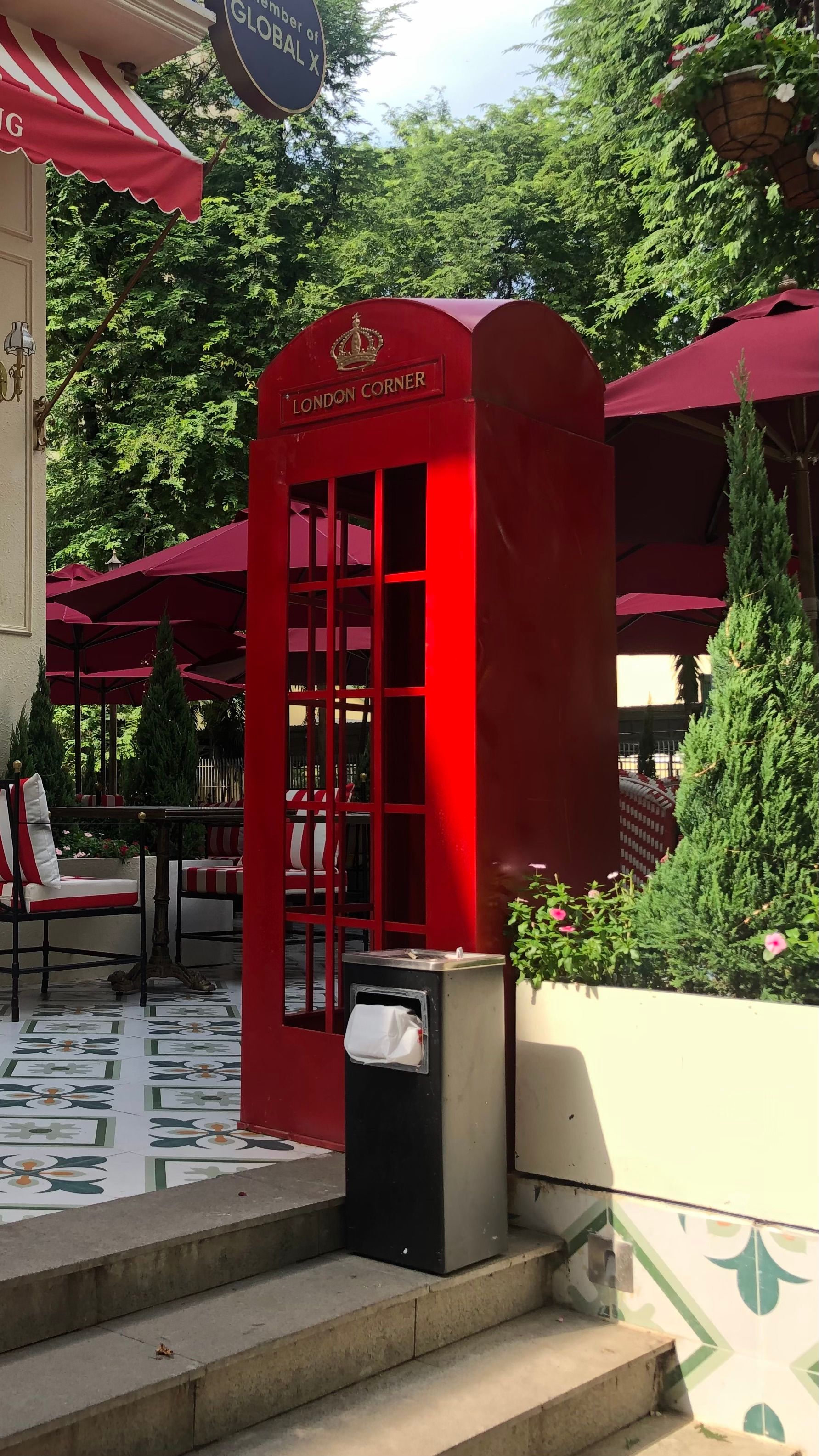 Red Telephone Booth in Stylish Outdoor Cafe · Free Stock Photo