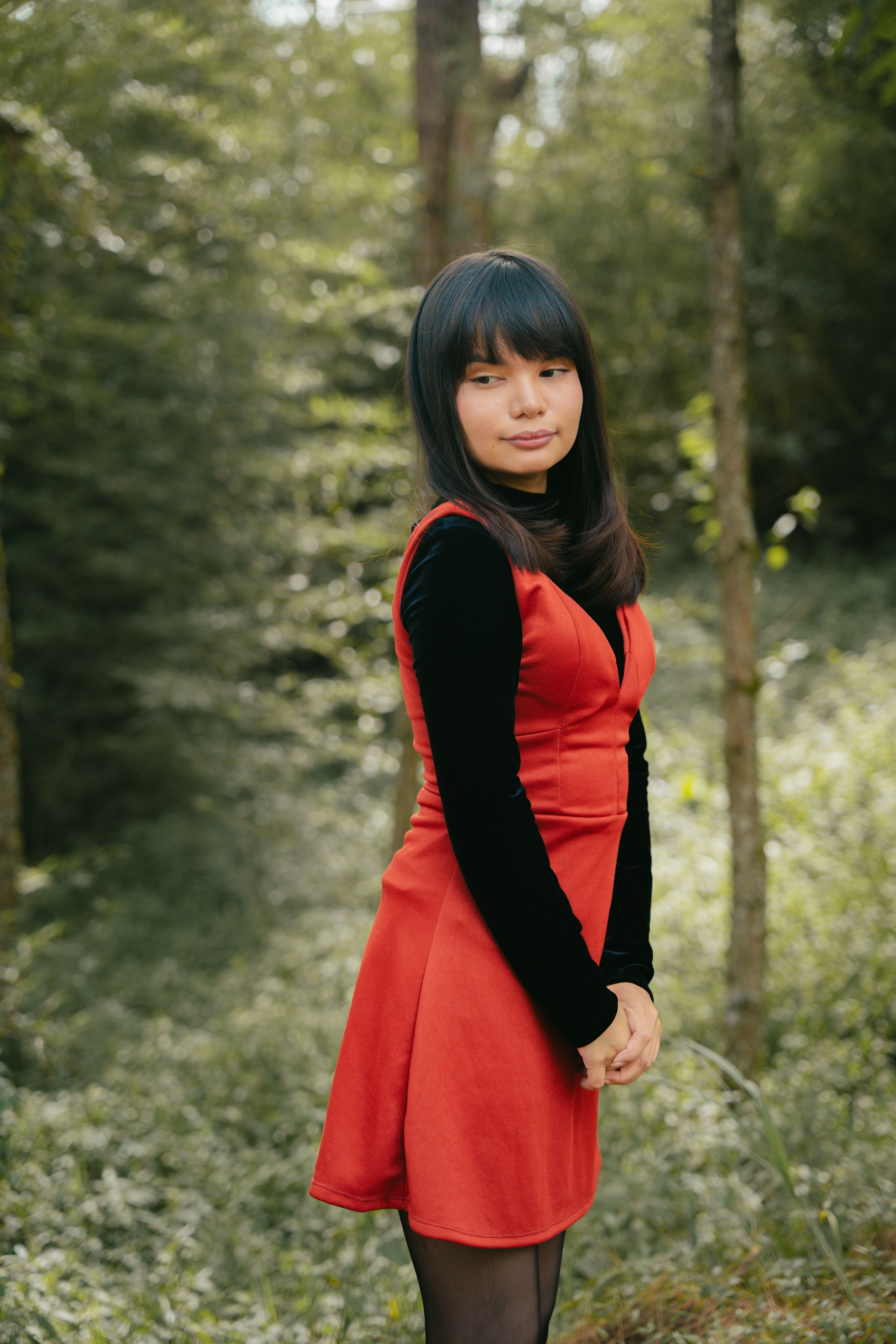 Young Woman in Red Dress in Forest Setting · Free Stock Photo