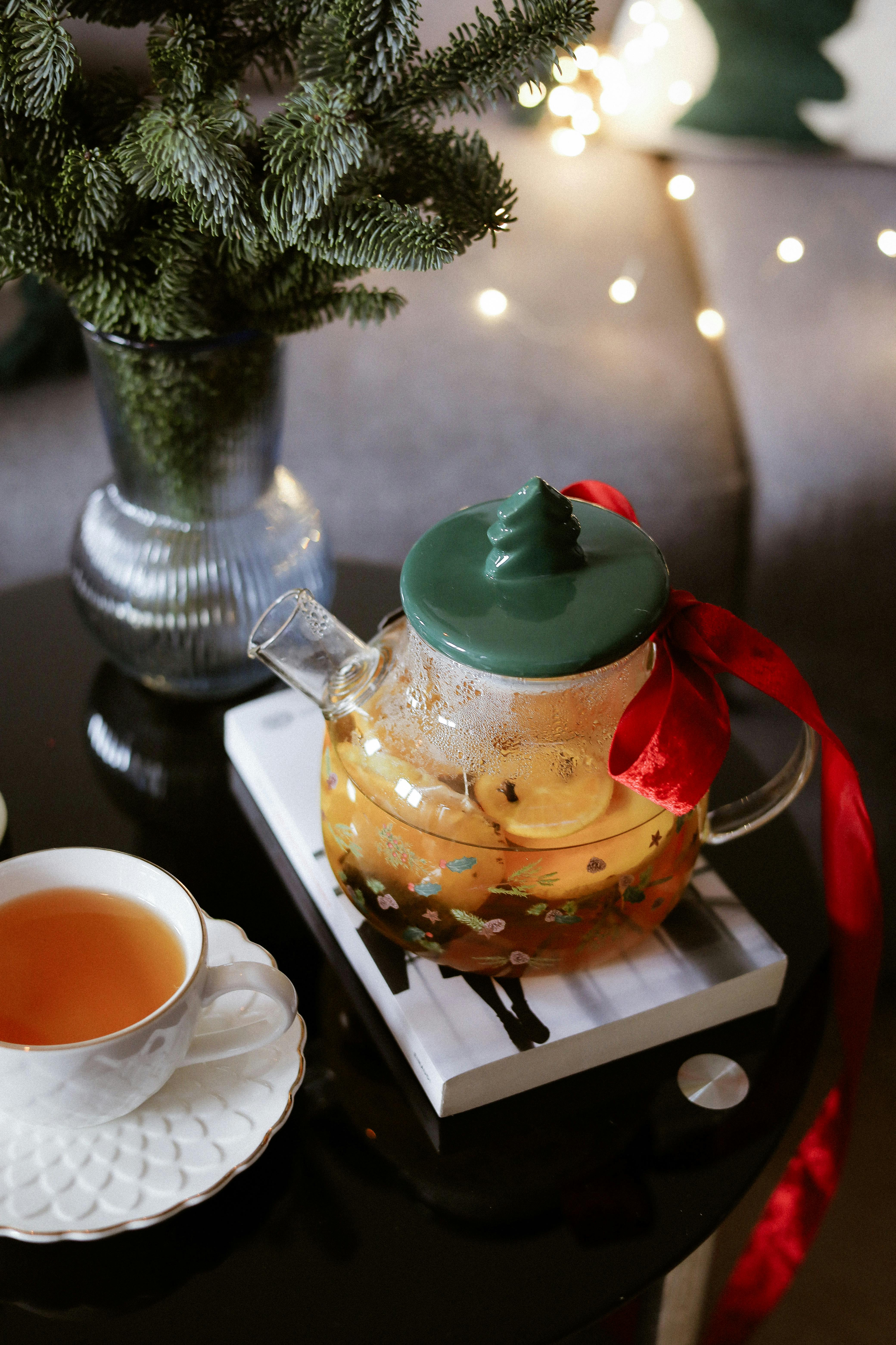 Cozy Winter Tea Setup with Festive Decorations · Free Stock Photo
