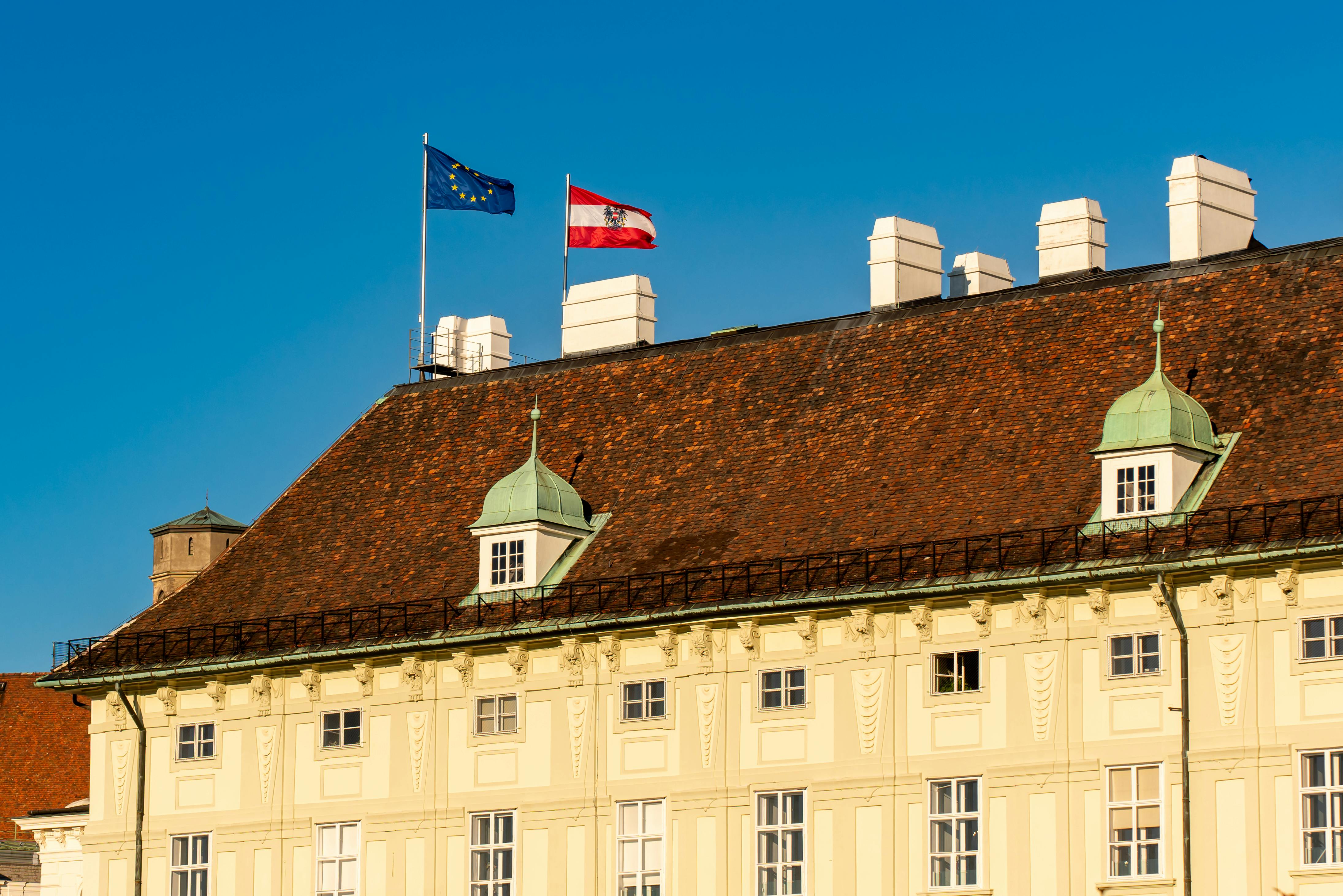 Austrian Government Building with Flags in Vienna · Free Stock Photo