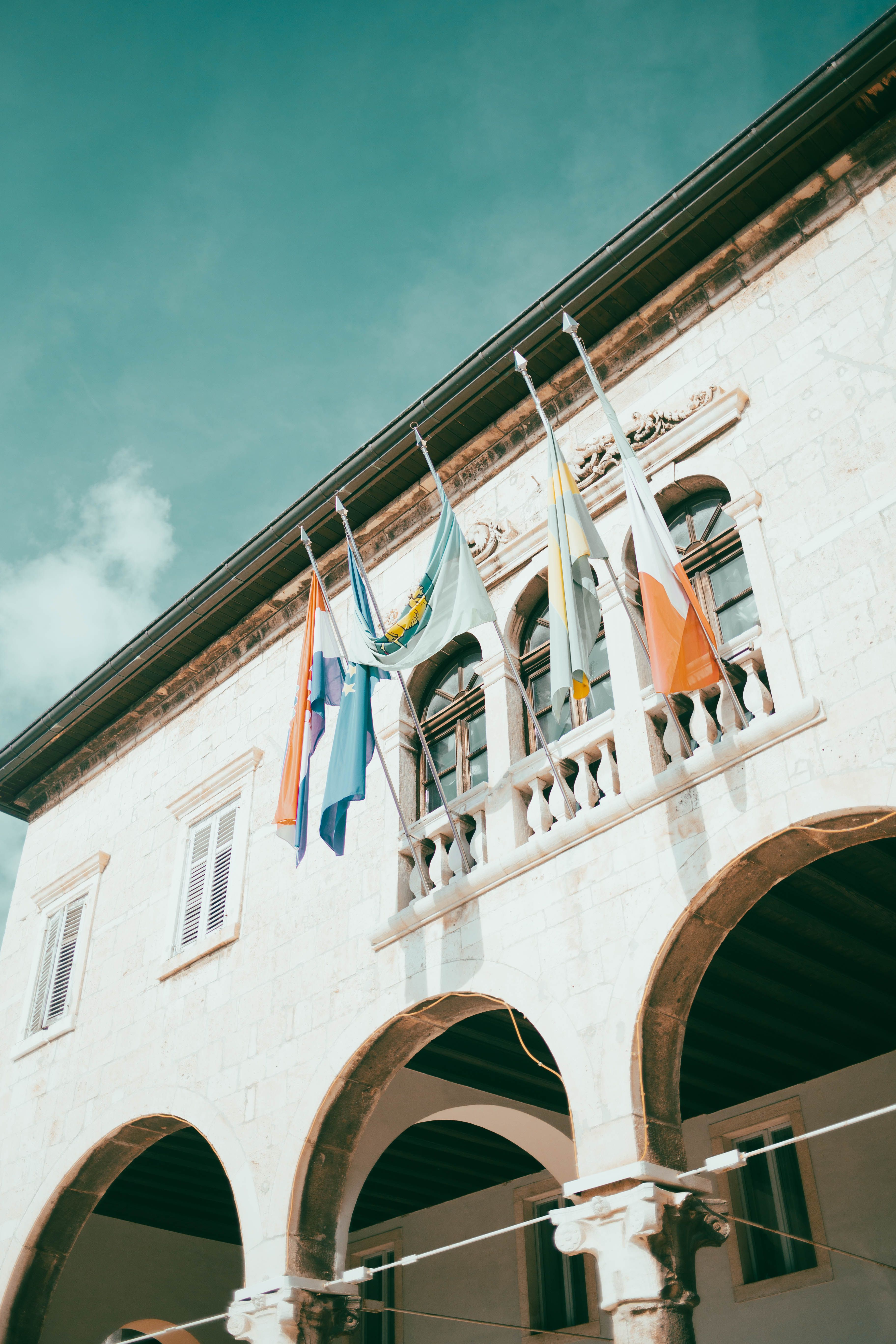 Historical Architecture with Flags in Pula, Croatia · Free Stock Photo
