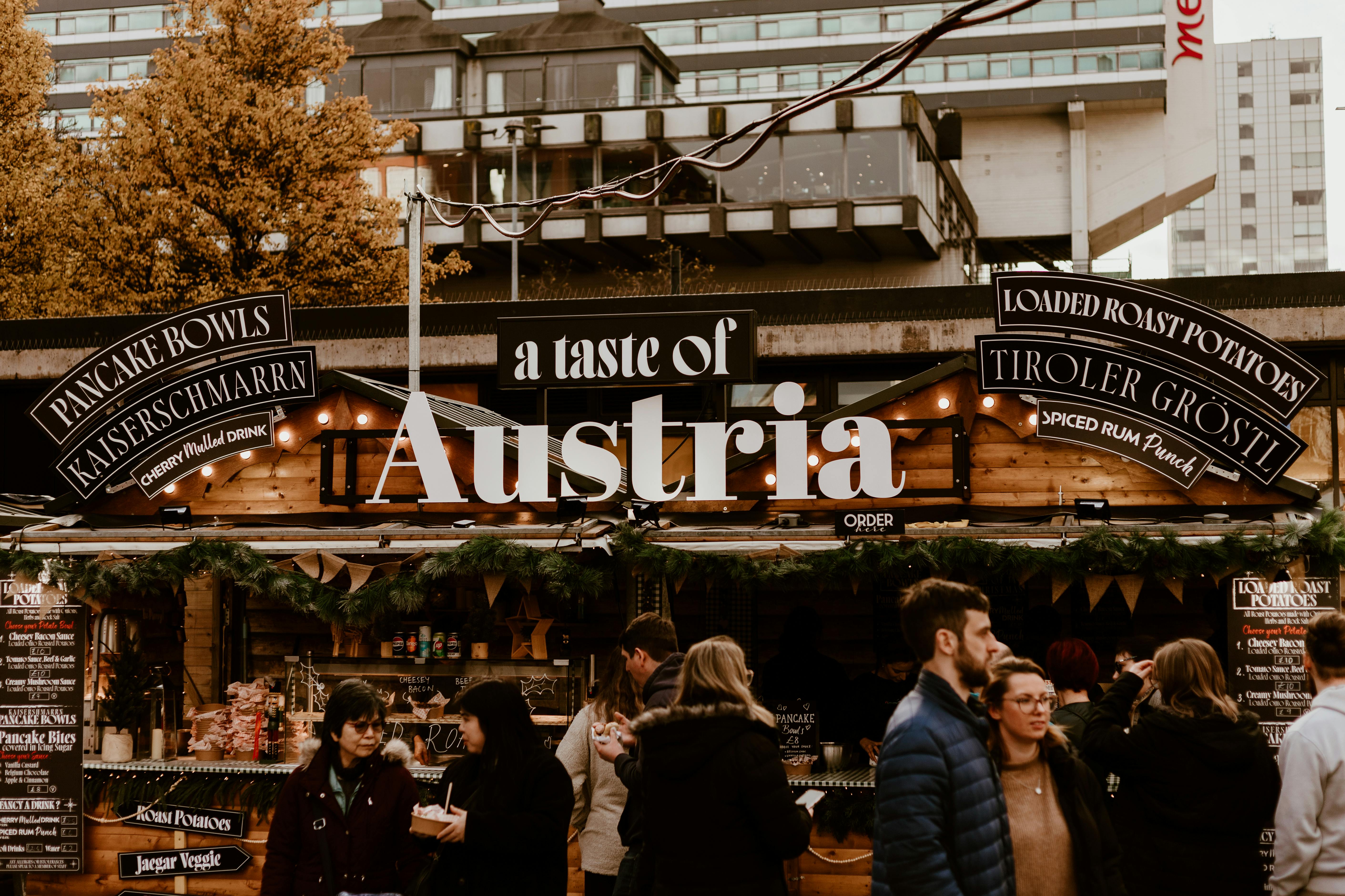 Vibrant Austrian Food Market Stall in Autumn · Free Stock Photo