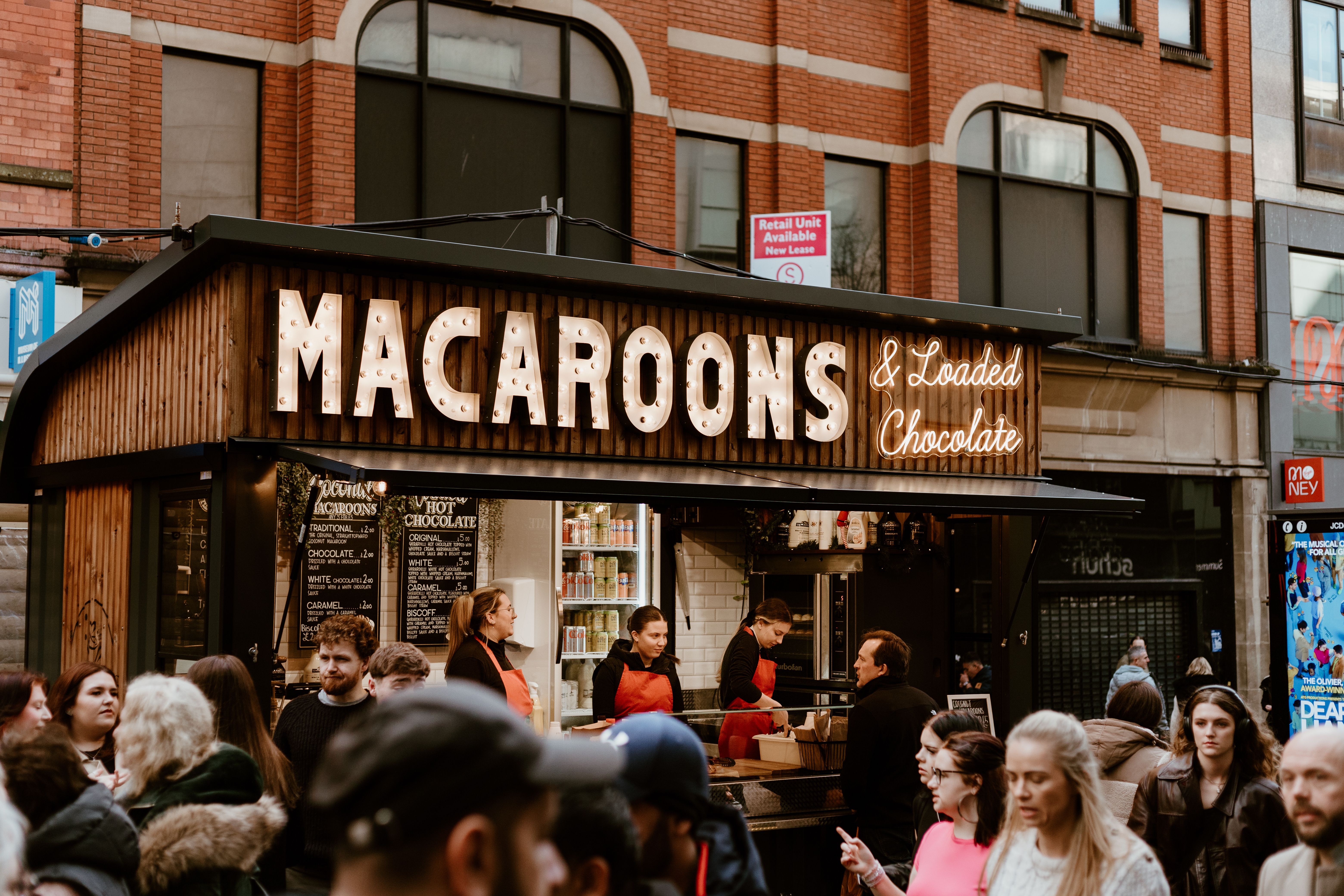 Busy Outdoor Food Stall in Urban City Center · Free Stock Photo
