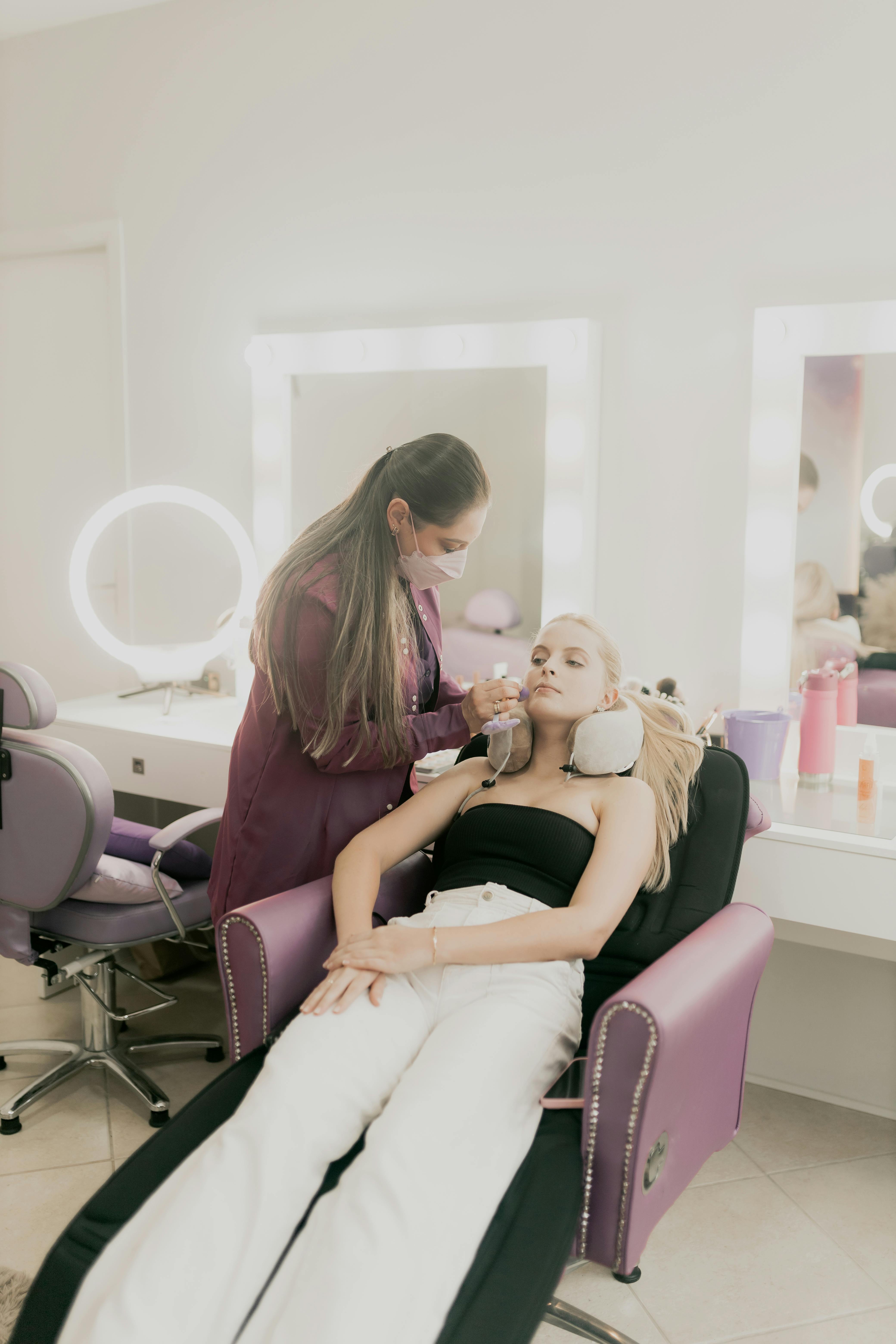 Professional Makeup Application in Salon · Free Stock Photo