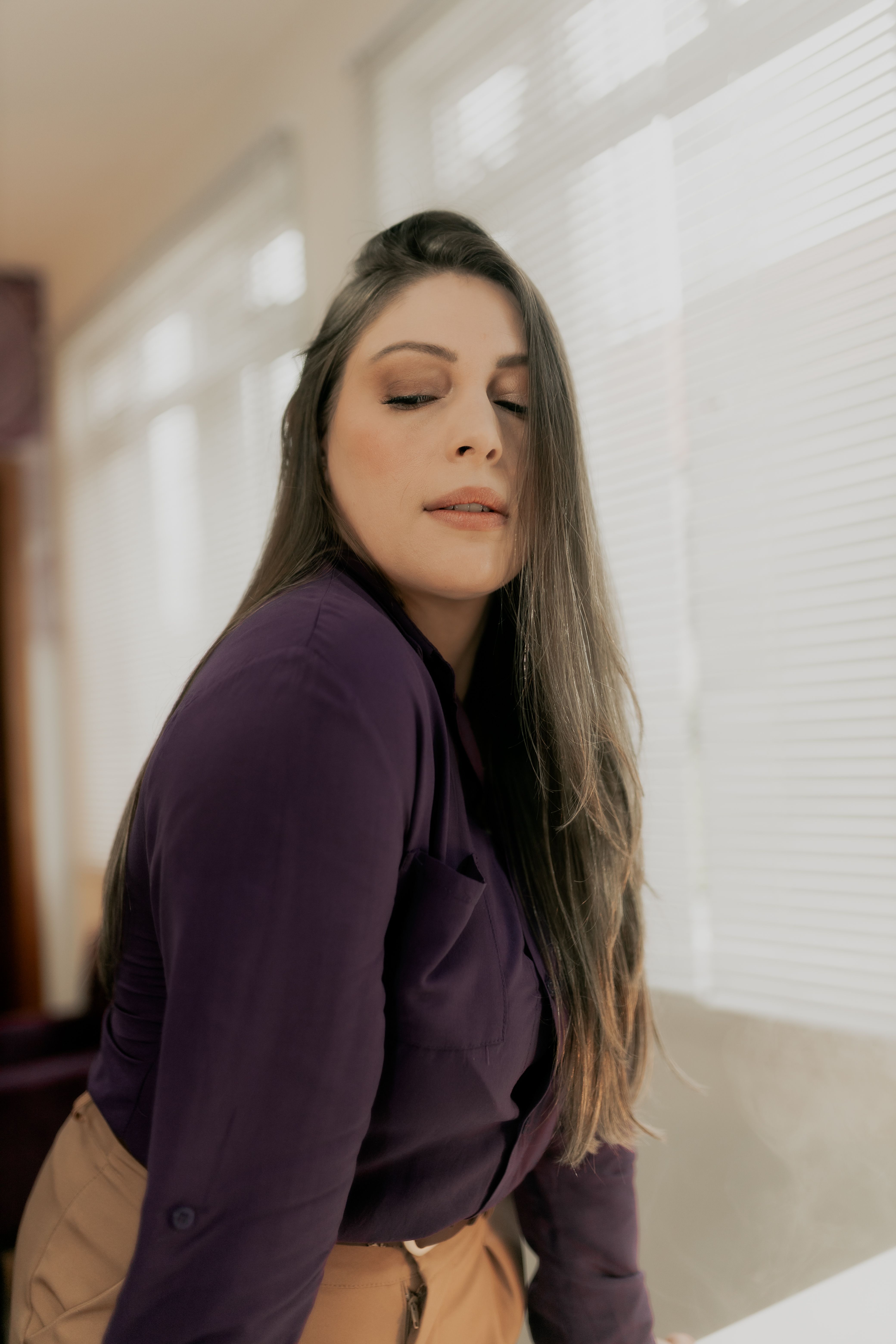 Portrait of a Thoughtful Woman by Window Light · Free Stock Photo