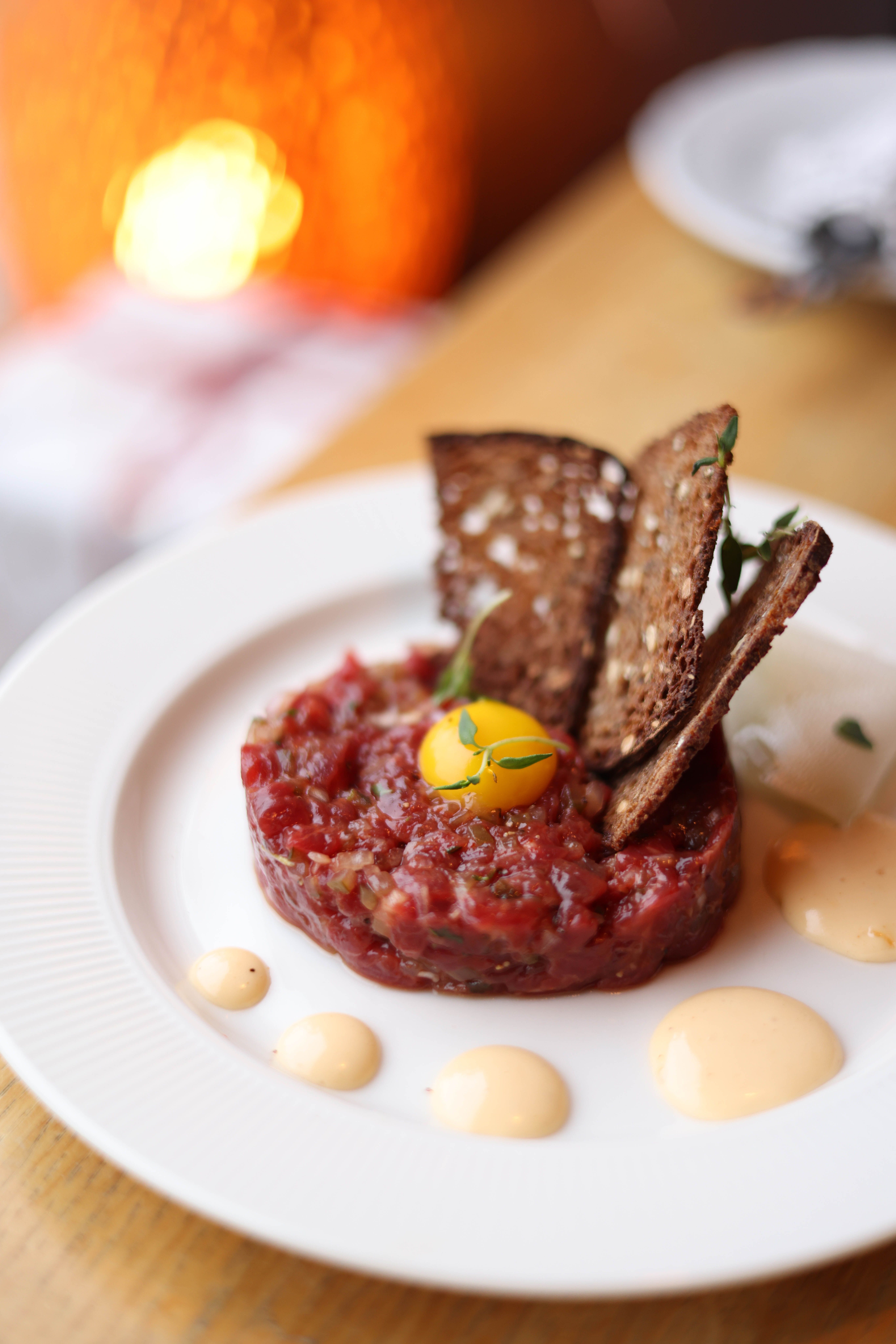 Gourmet Beef Tartare with Quail Egg and Rye Crisps · Free Stock Photo