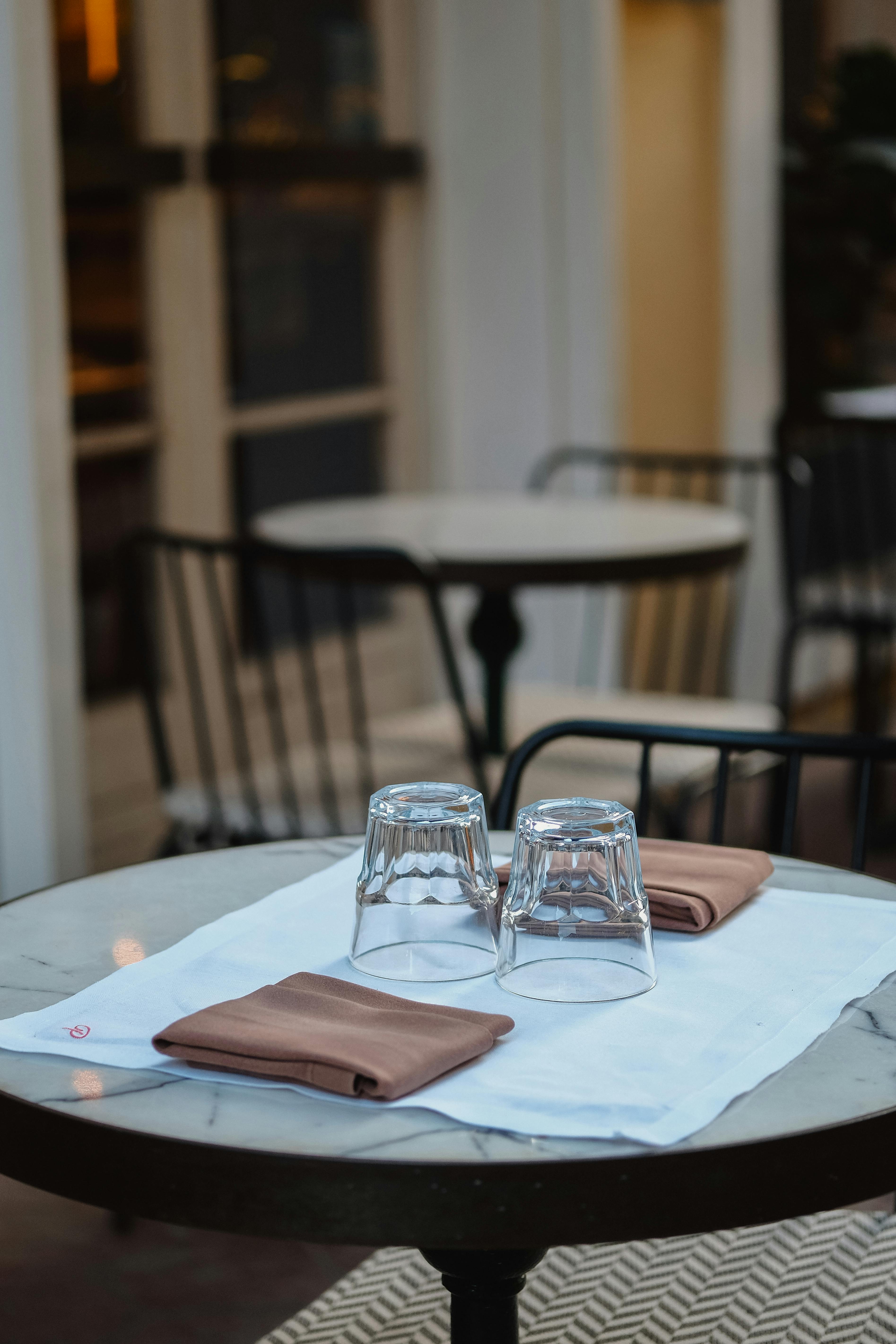 Elegant Outdoor Cafe Table Setting at Dusk · Free Stock Photo