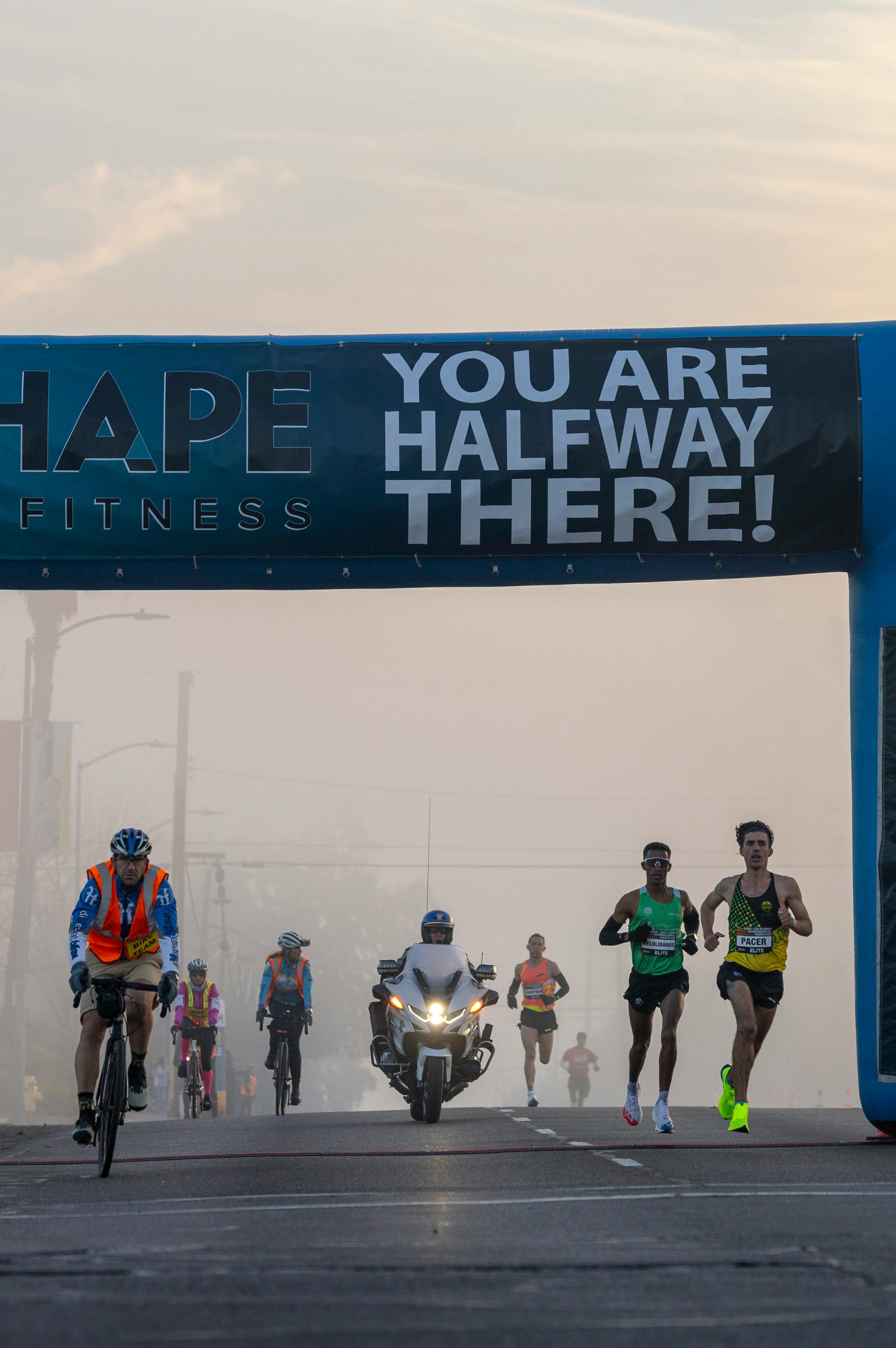 Marathon Runners Approaching Halfway Point · Free Stock Photo