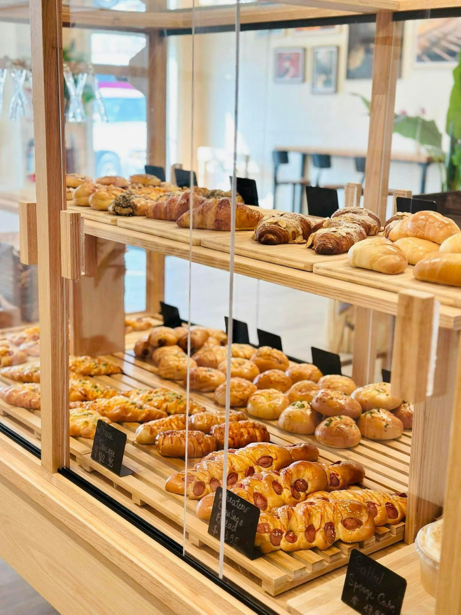 Freshly Baked Pastries Display in Bakery · Free Stock Photo
