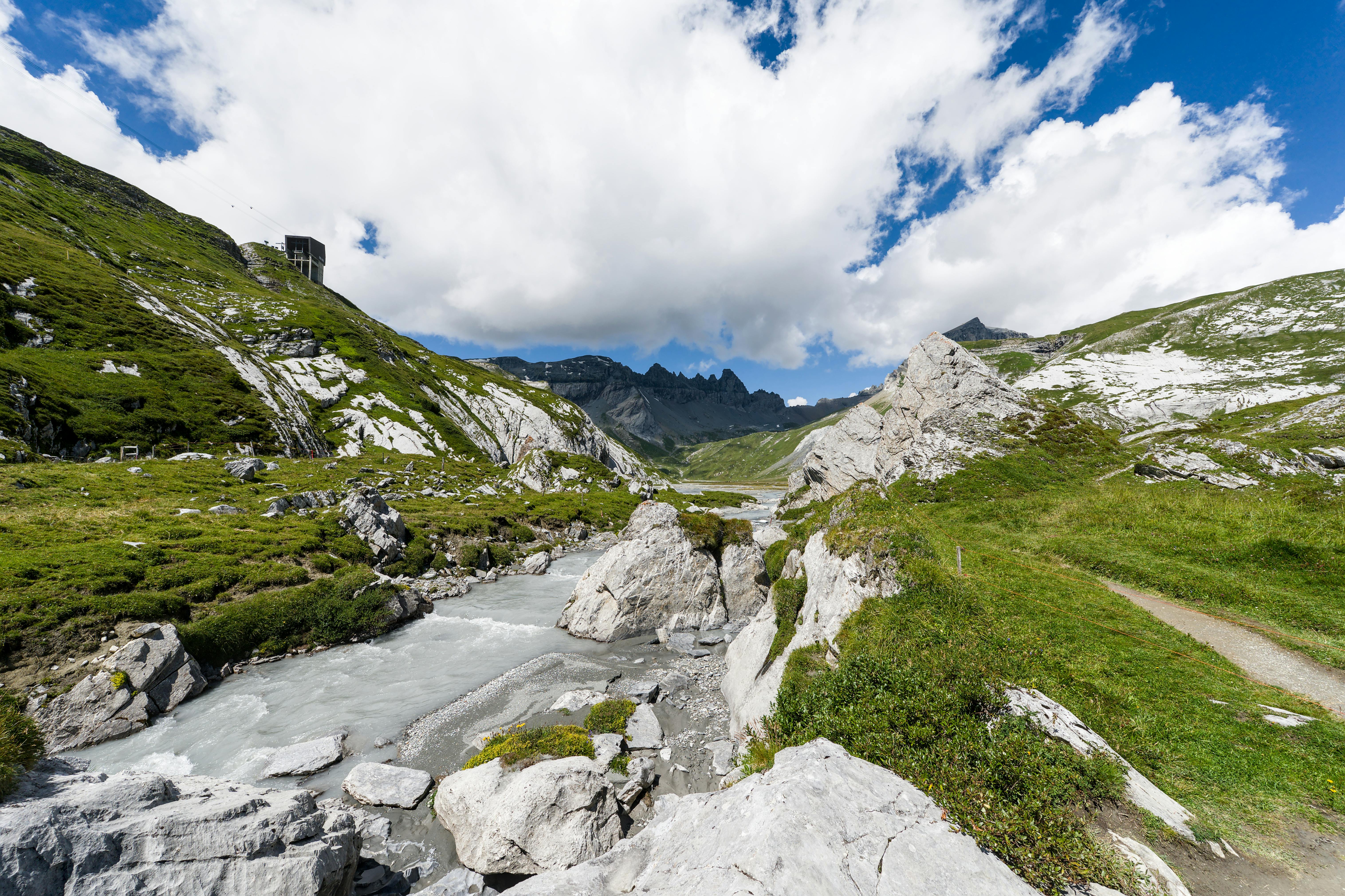 Scenic Alpine Landscape with Rushing Stream · Free Stock Photo