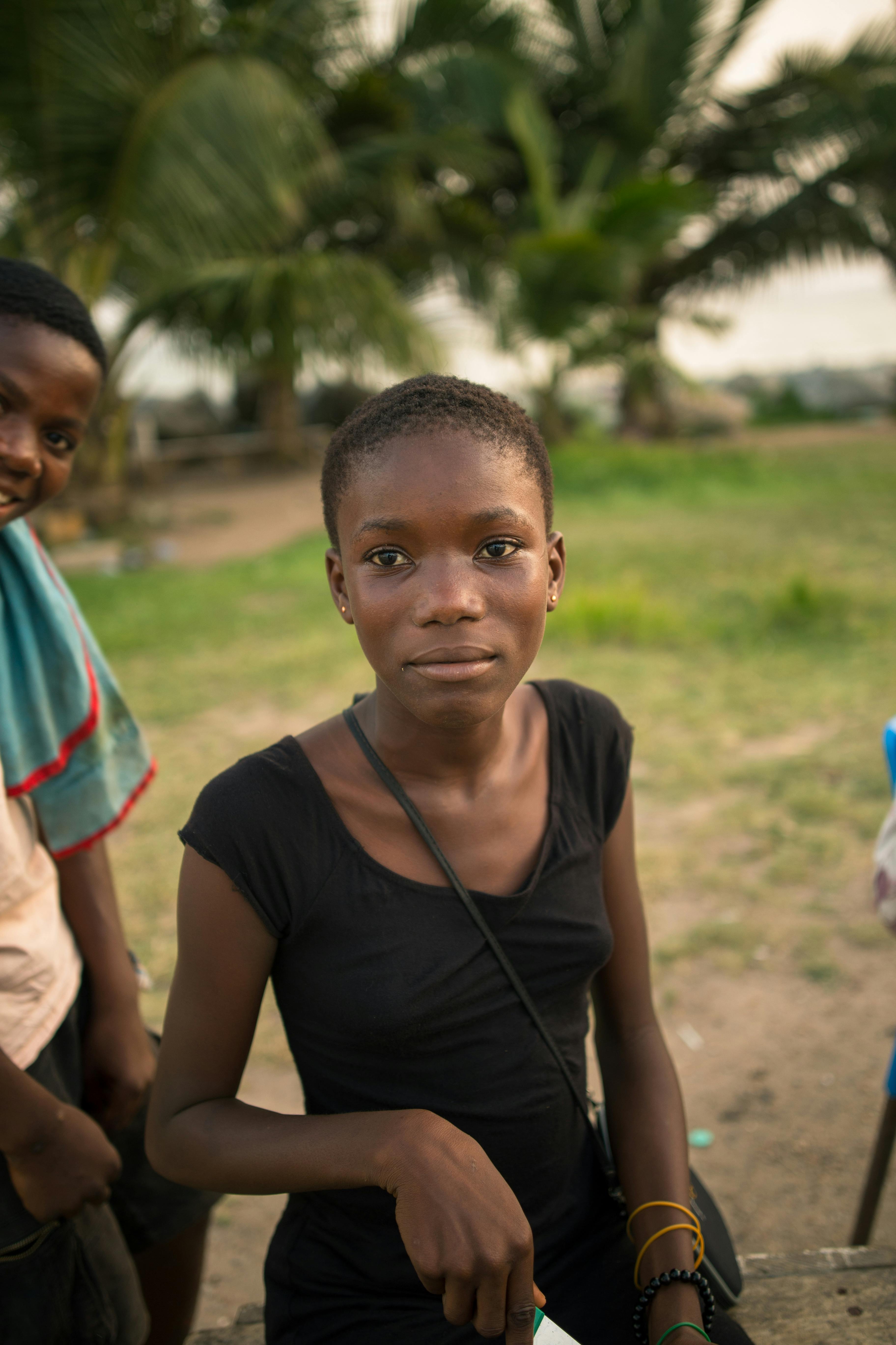 Smiling Girl in Traditional Dress Outdoors · Free Stock Photo