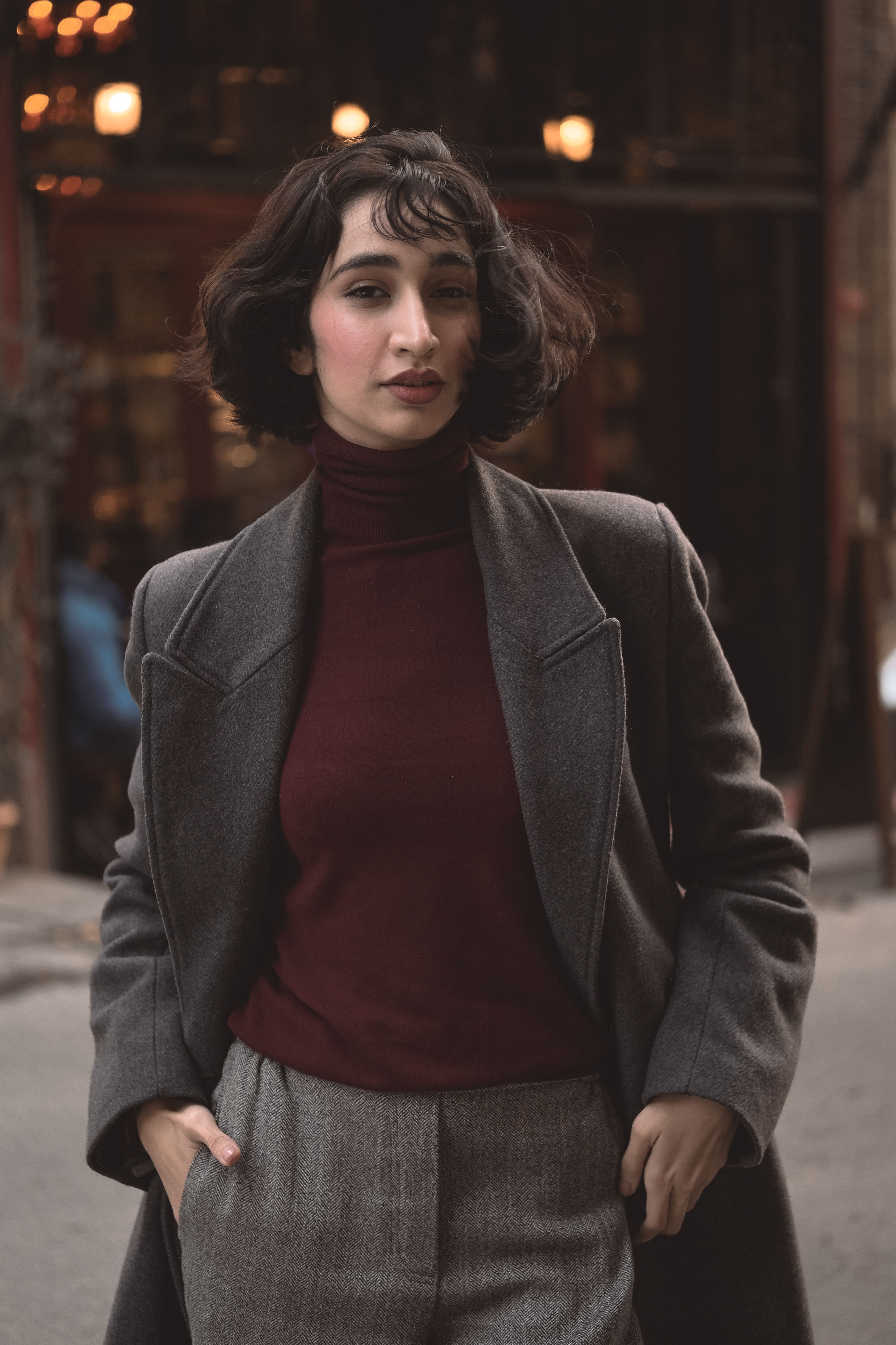 Stylish Woman in Gray Overcoat on Urban Street · Free Stock Photo