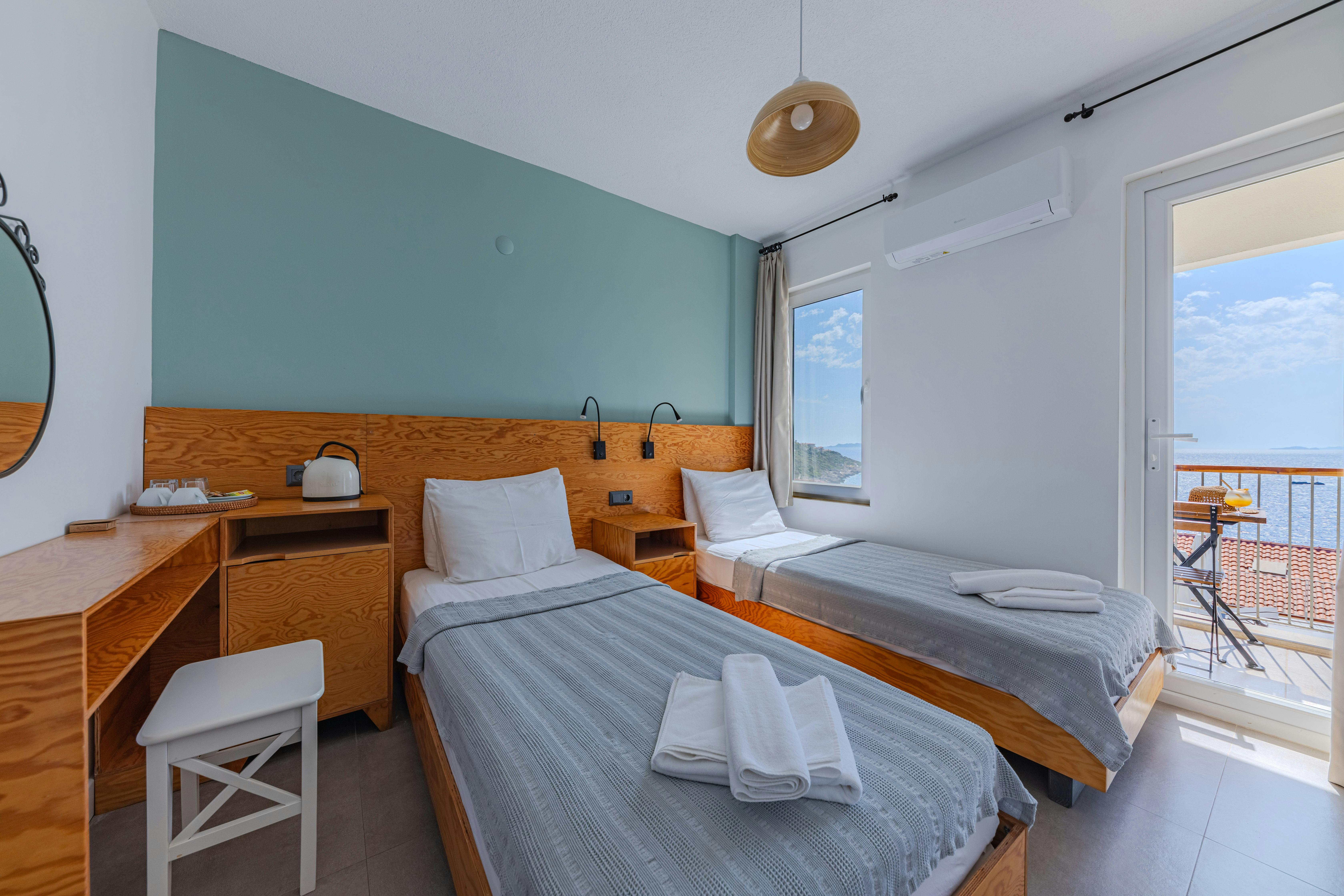 Modern Hotel Room with Ocean View and Twin Beds · Free Stock Photo