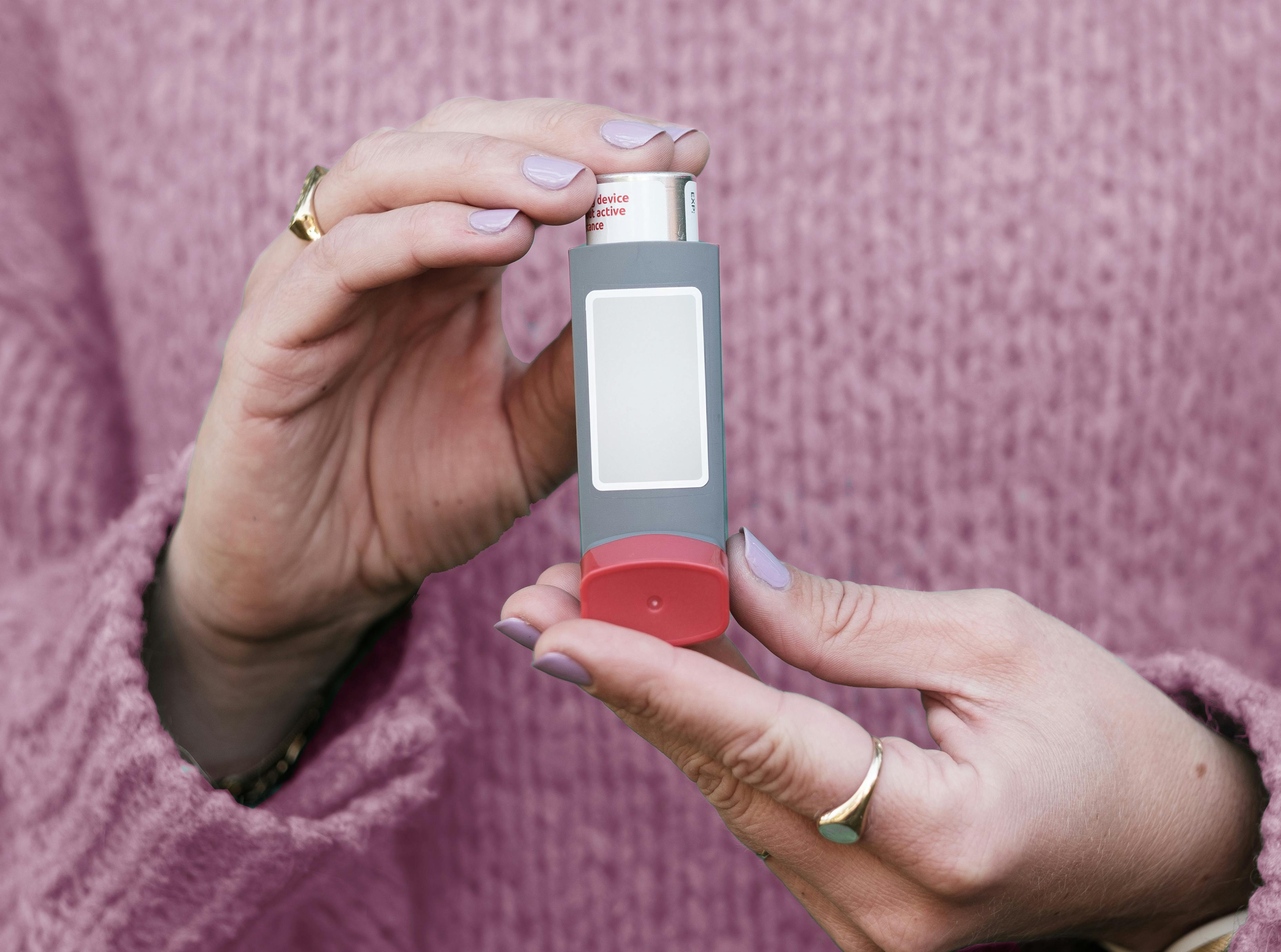 Close-up of Man Using Inhaler for Asthma Relief · Free Stock Photo