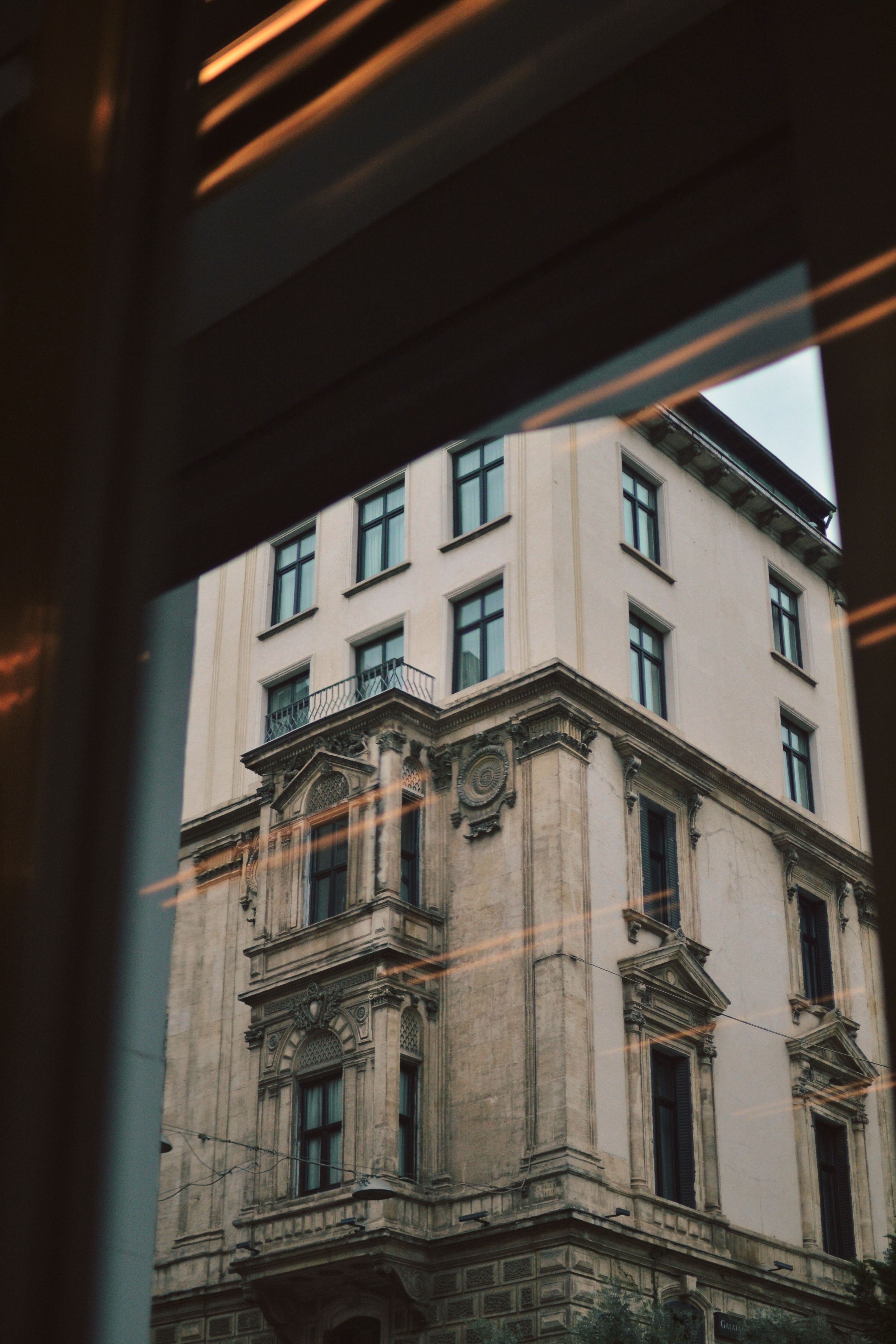 Vintage European Building View Through Window · Free Stock Photo