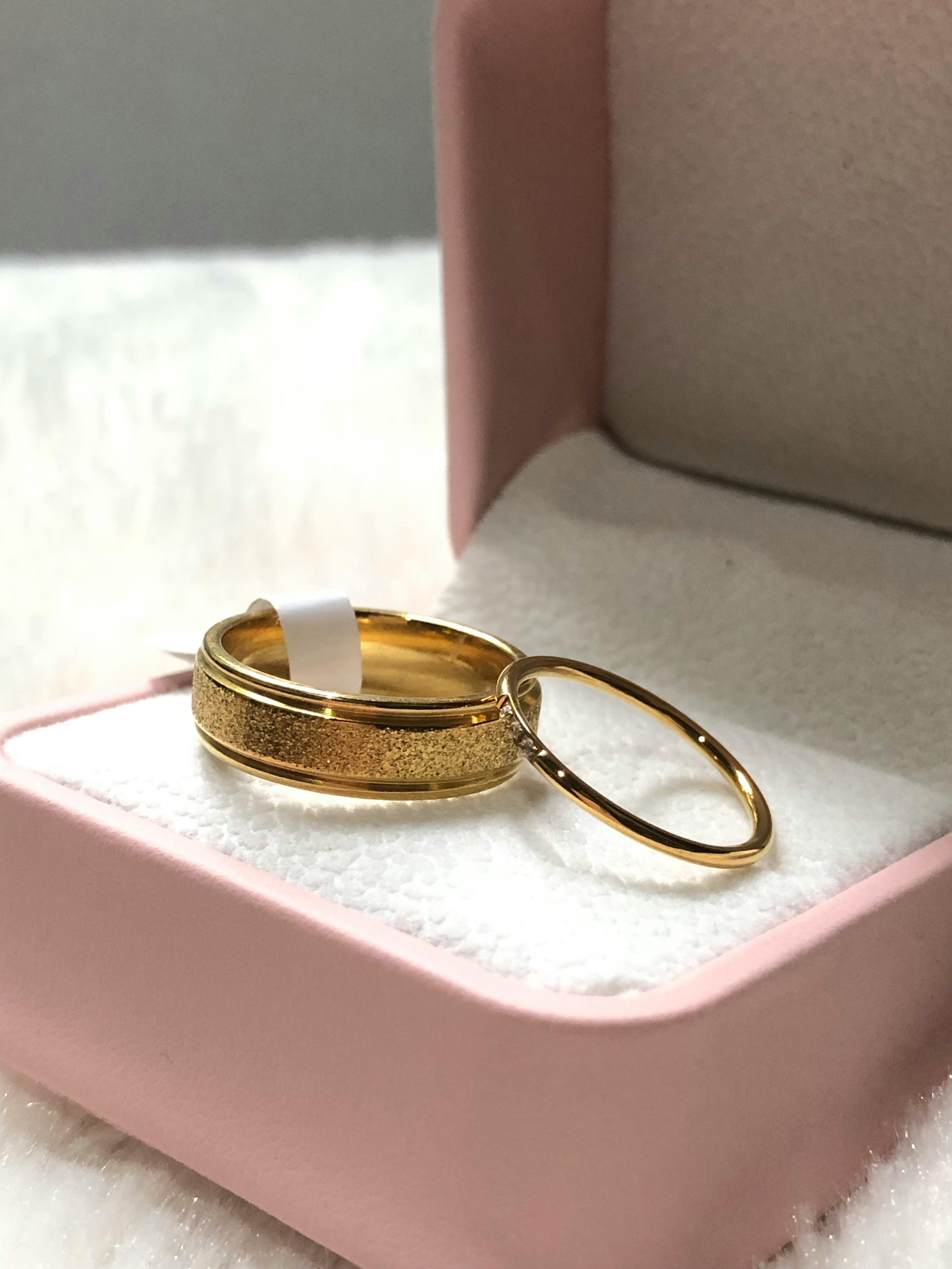 Elegant Gold Wedding Rings in Pink Box · Free Stock Photo