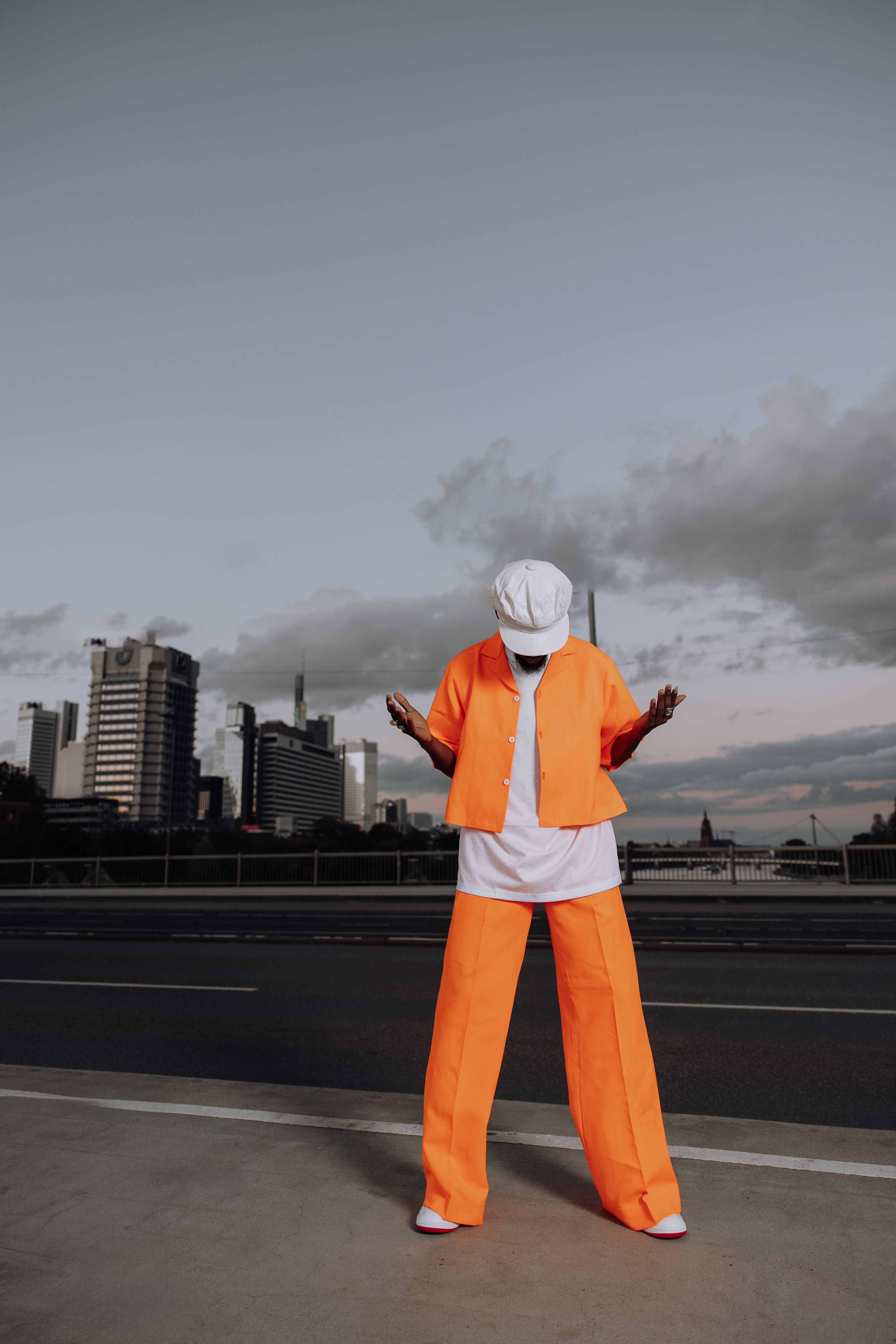 Stylish Individual in Vibrant Orange Outfit · Free Stock Photo