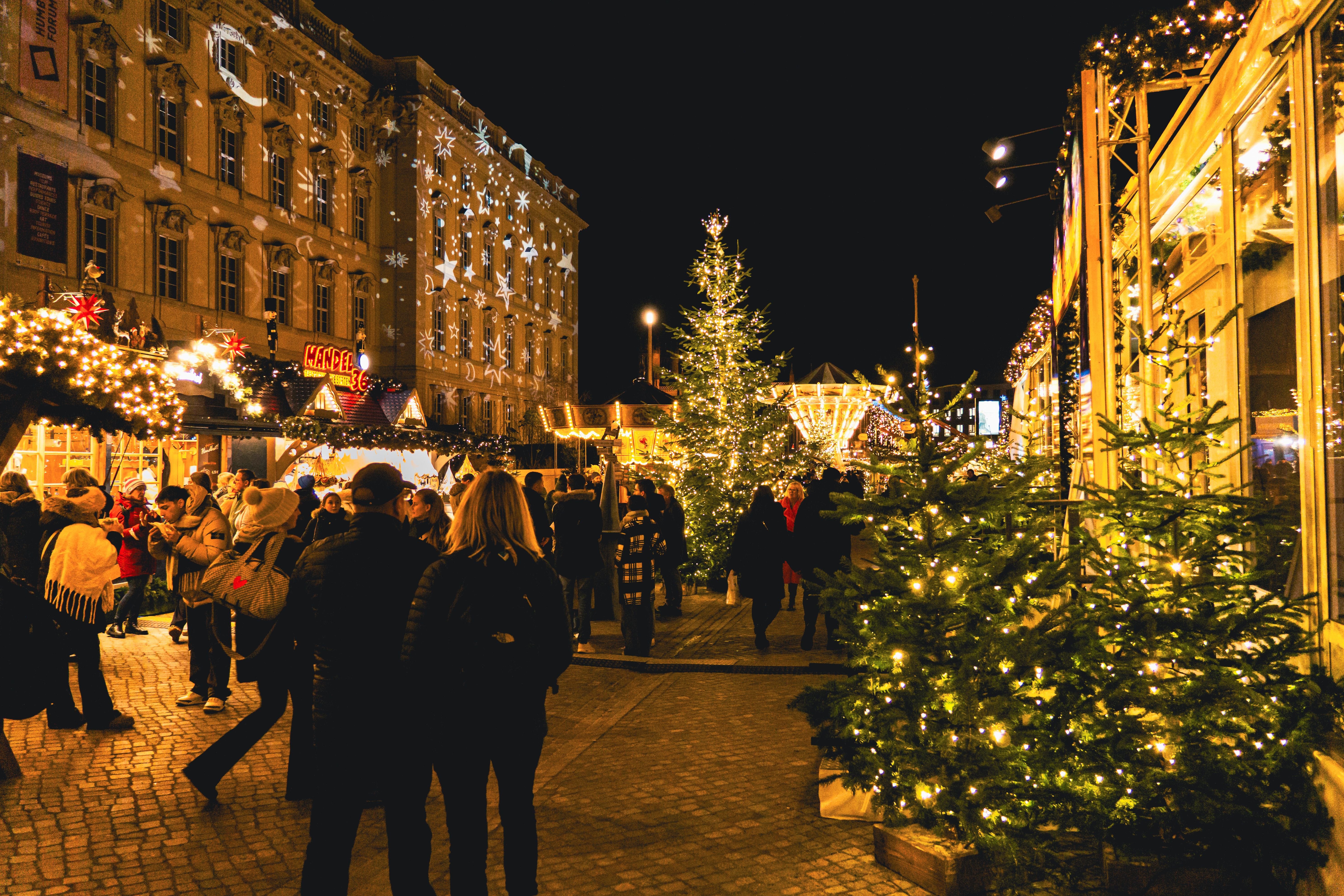 Vibrant Night Christmas Market Celebration · Free Stock Photo