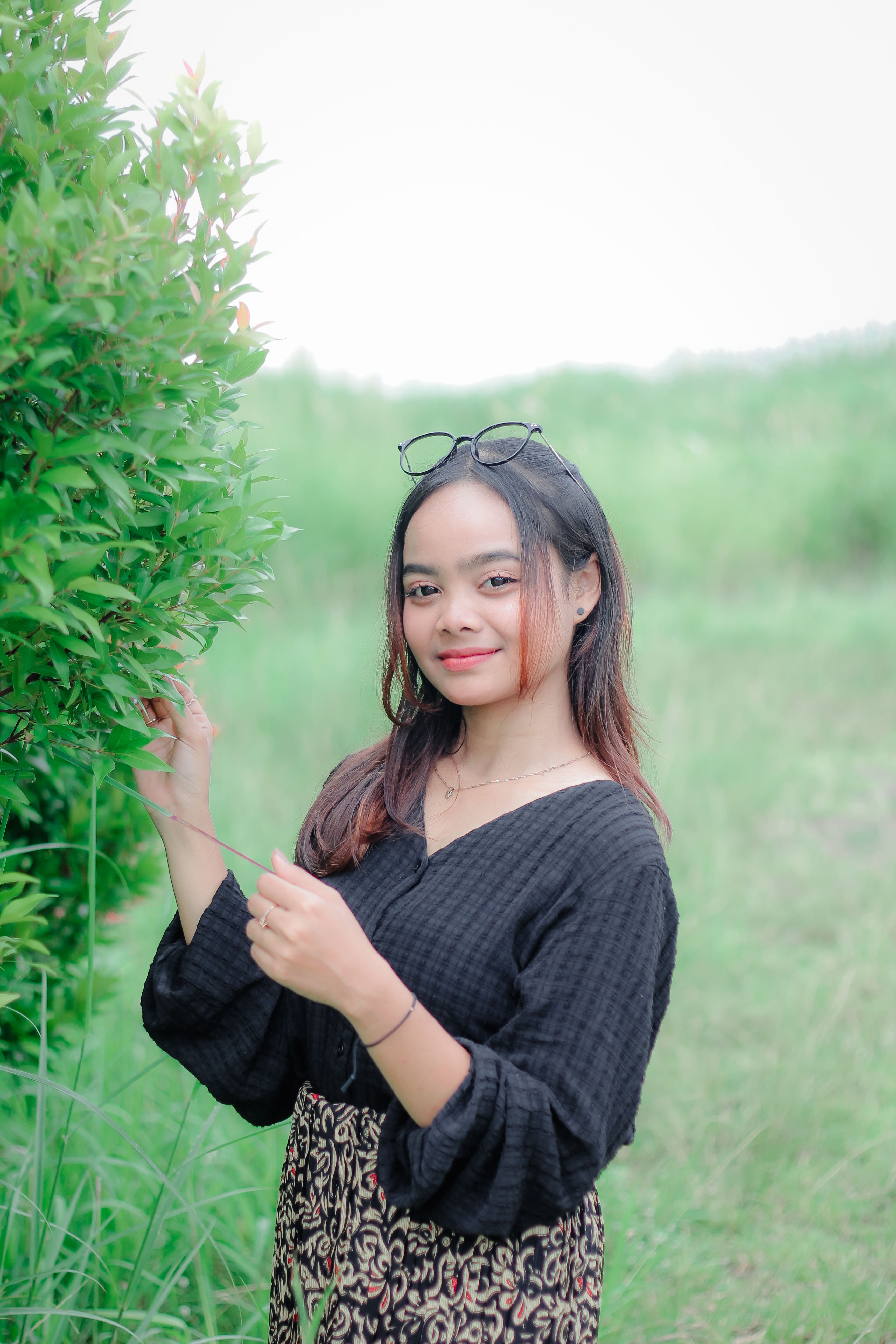 Young Woman Enjoying Greenery Outdoors · Free Stock Photo