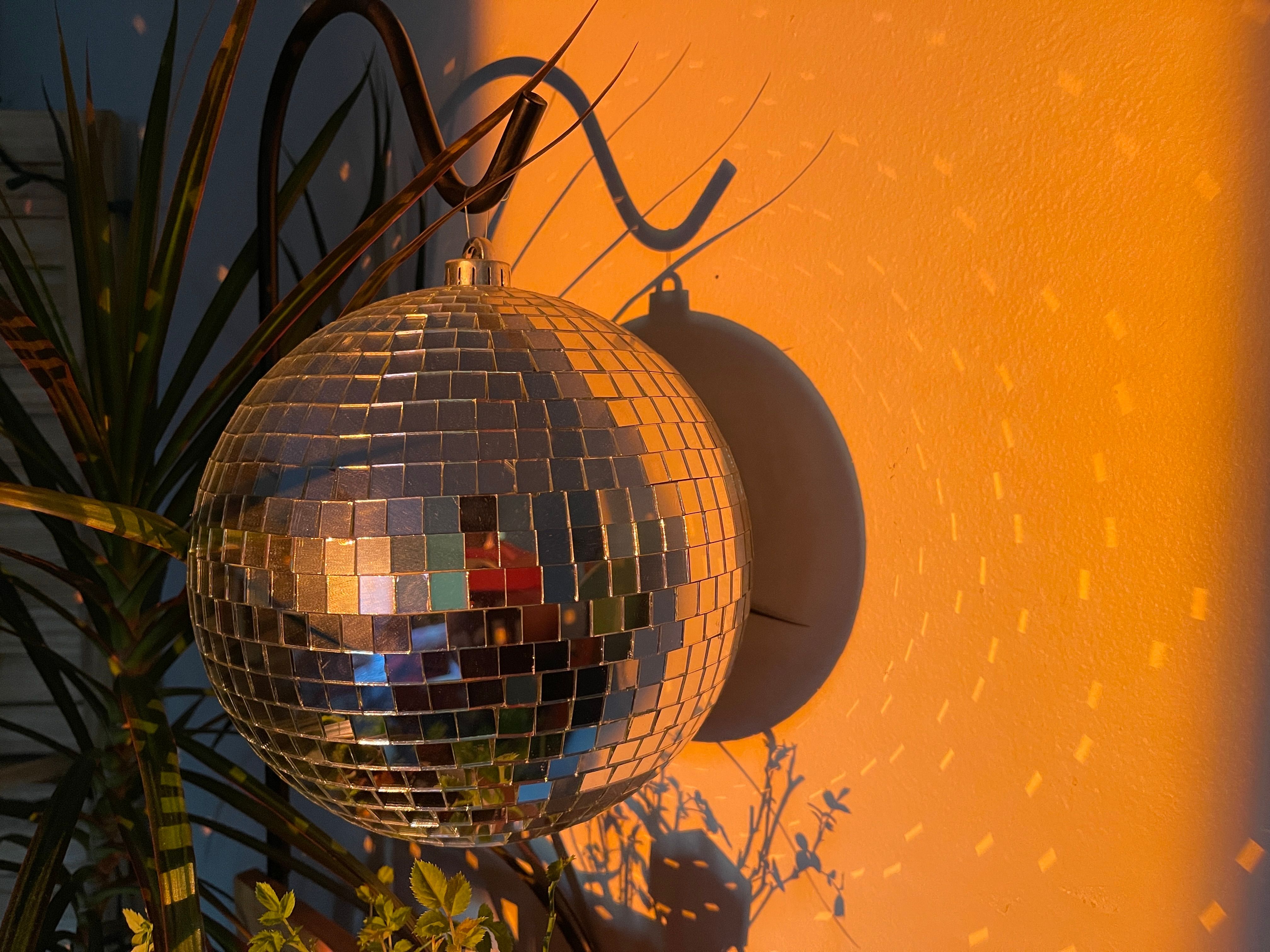 Disco Ball Casting Vibrant Shadows Indoors · Free Stock Photo