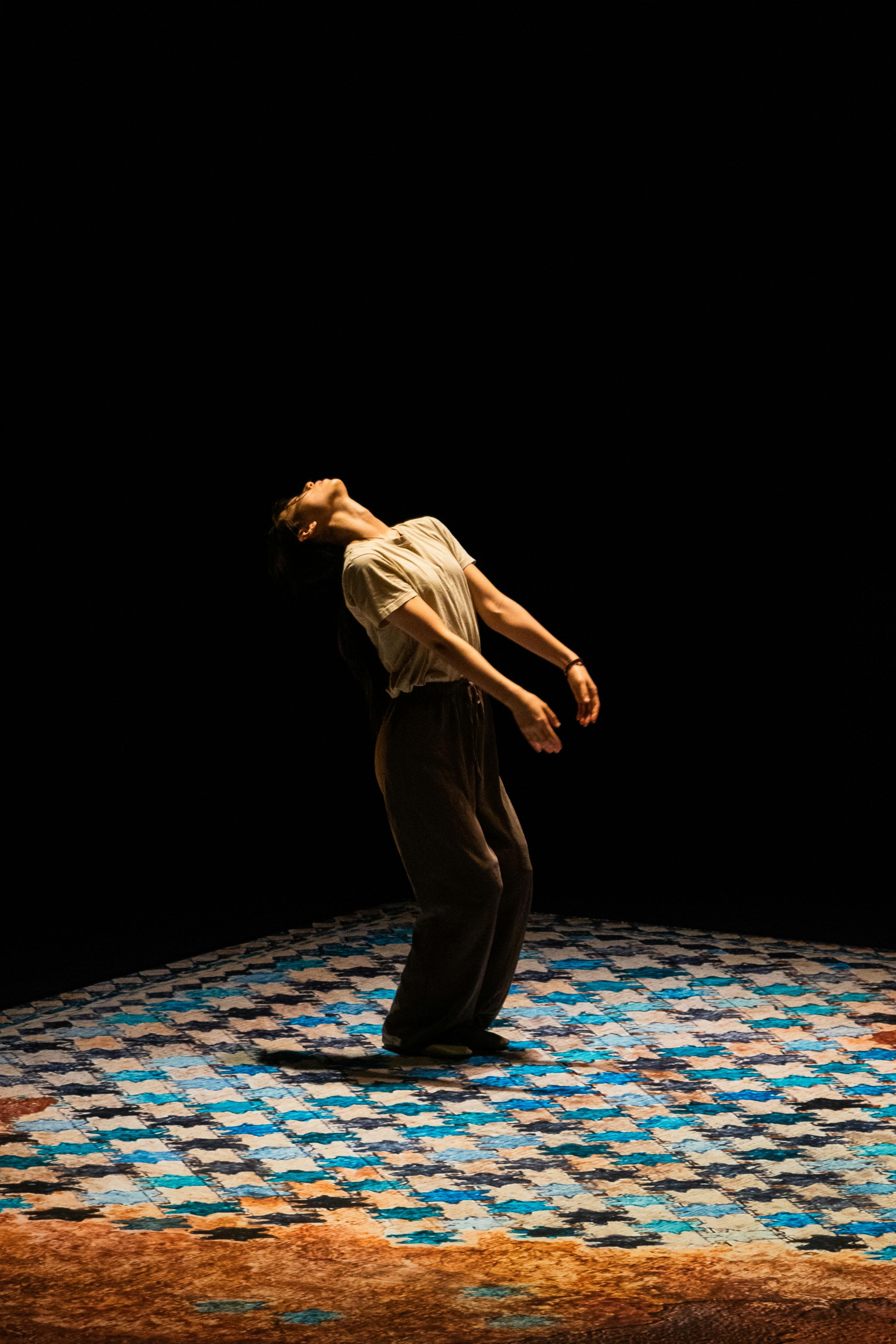 Dynamic Solo Dance Performance on Abstract Stage · Free Stock Photo