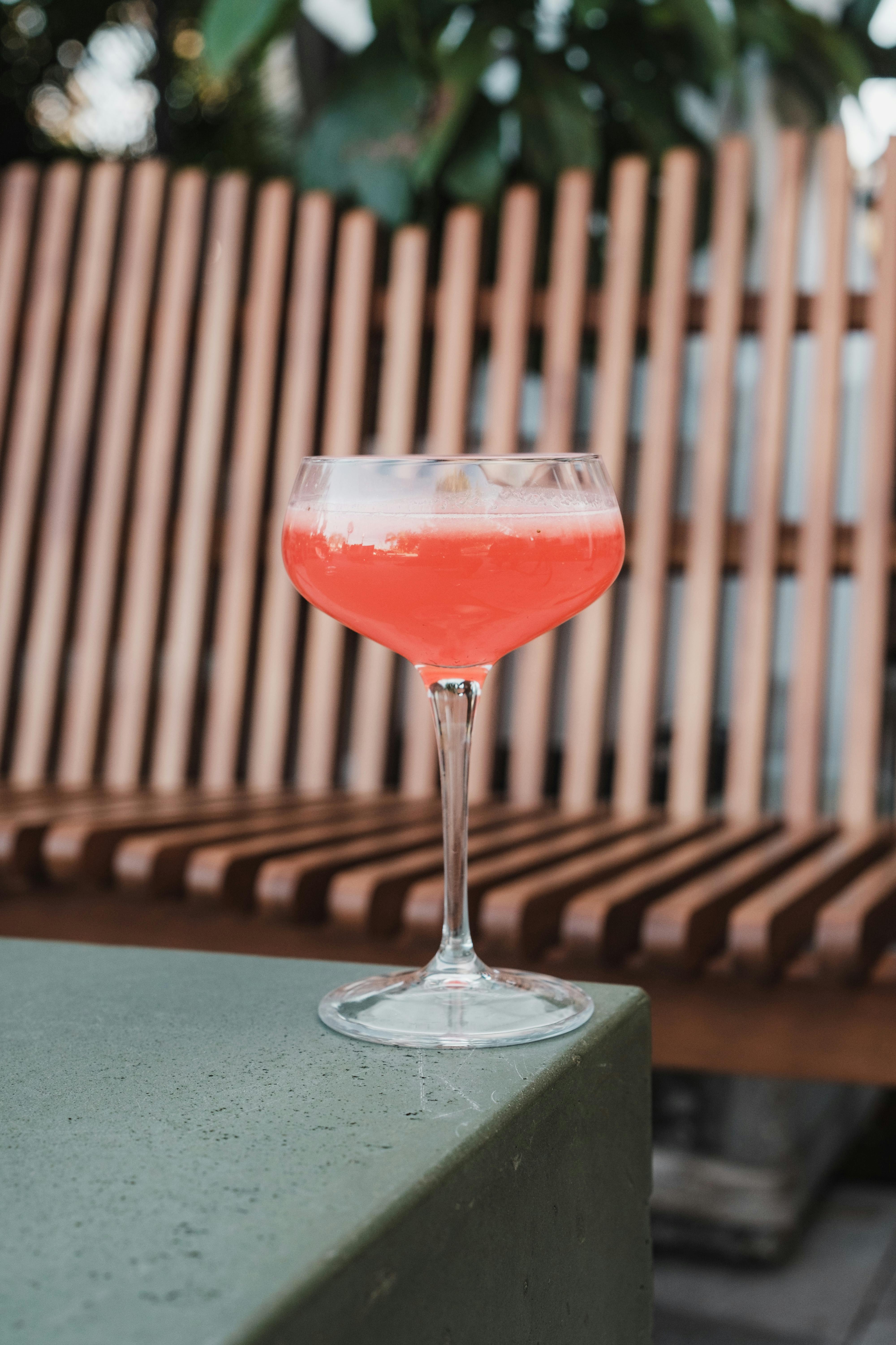 Refreshing Pink Cocktail on Outdoor Patio · Free Stock Photo