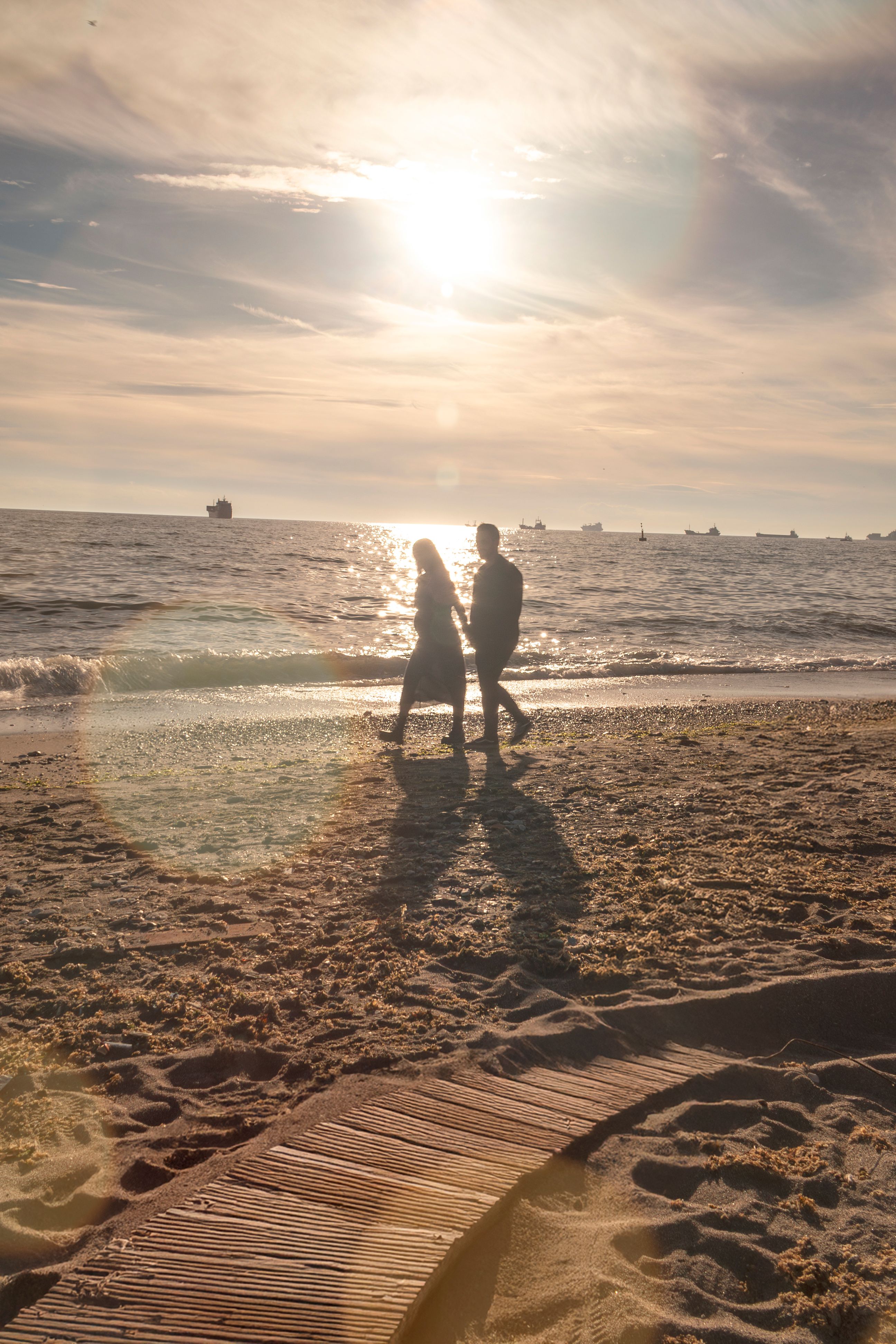 Romantic Beach Walk at Sunset · Free Stock Photo