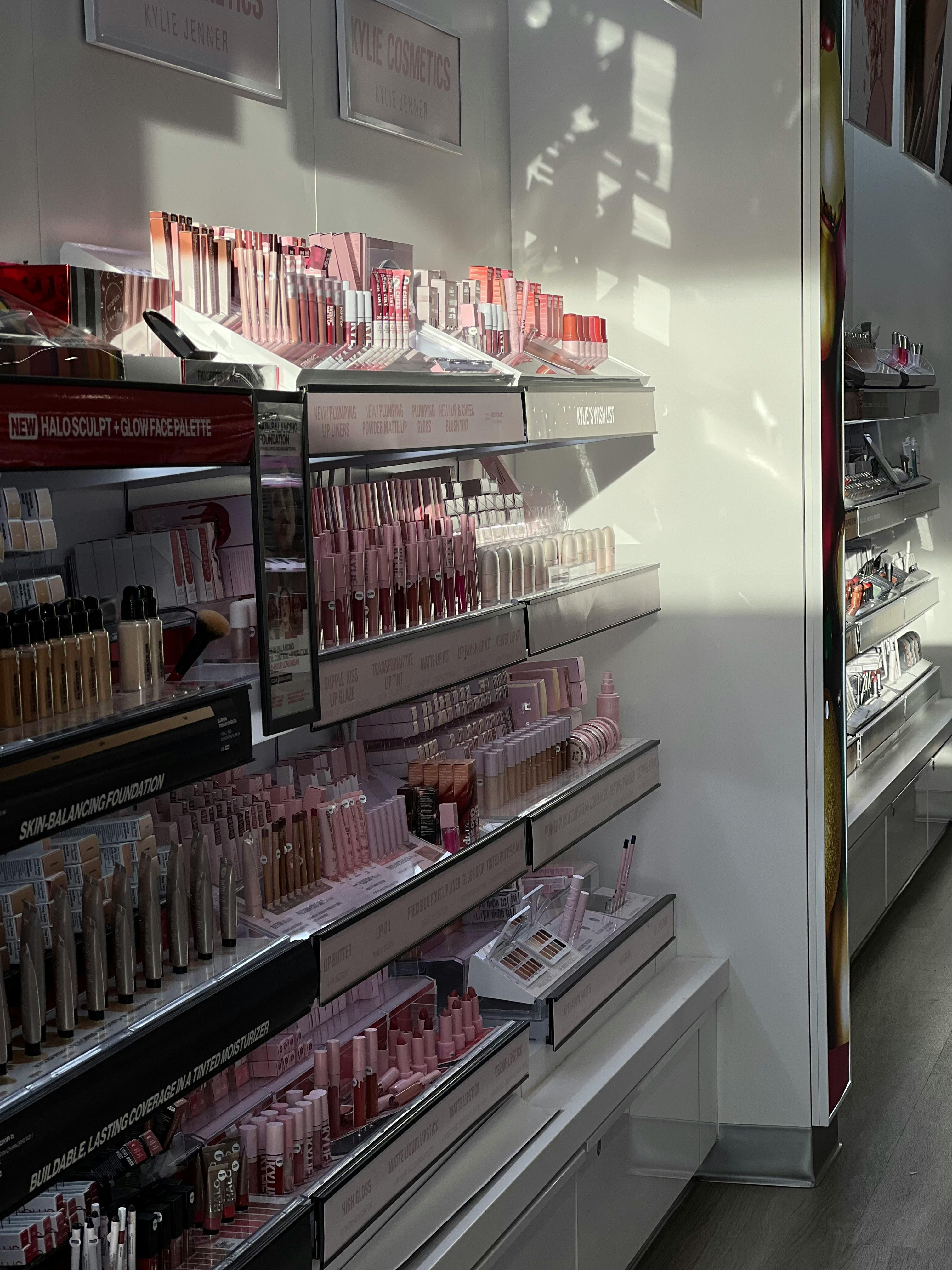 Cosmetic Store Aisle with Makeup Products Display · Free Stock Photo