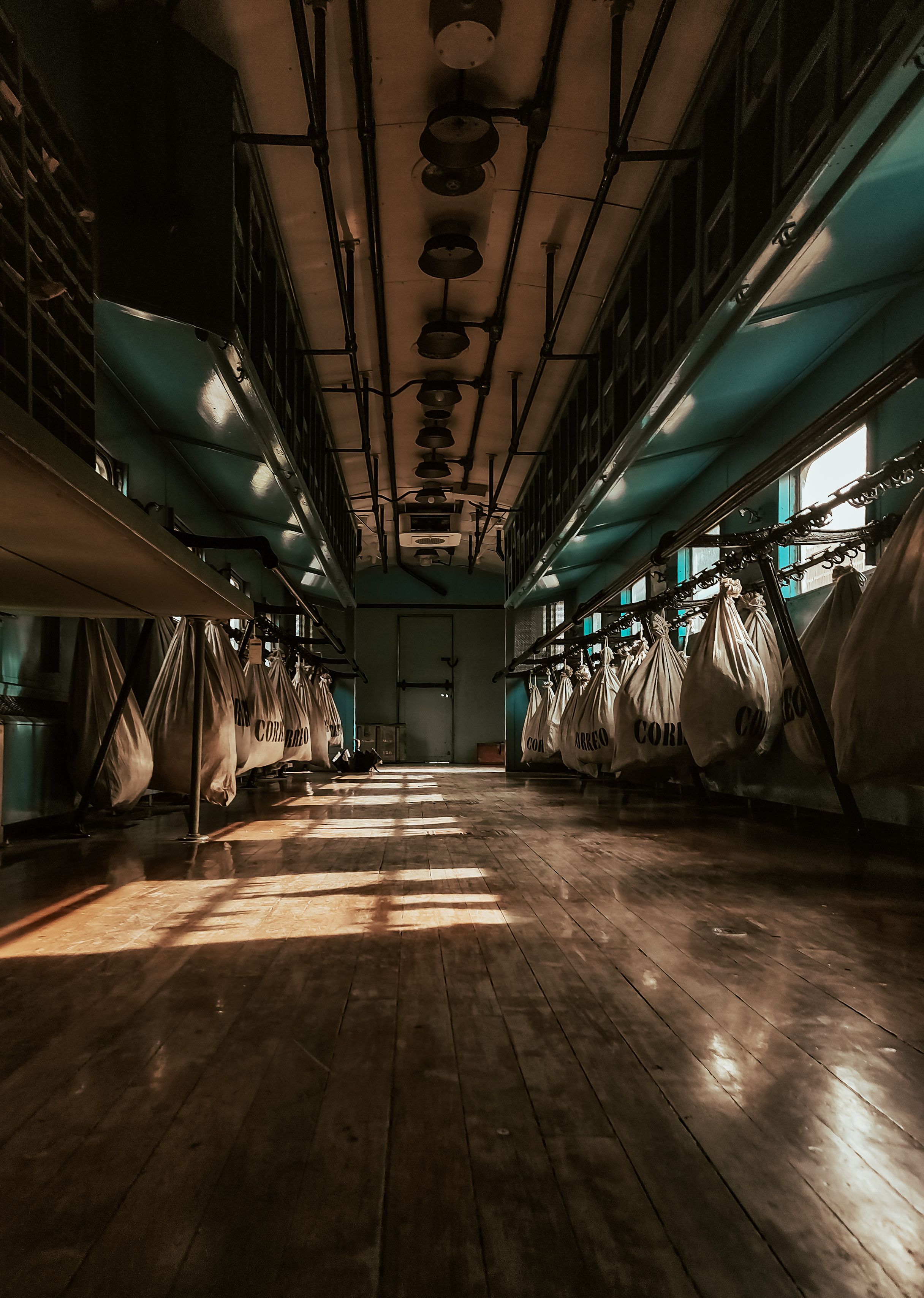 Vintage Mail Train Interior with Bags · Free Stock Photo