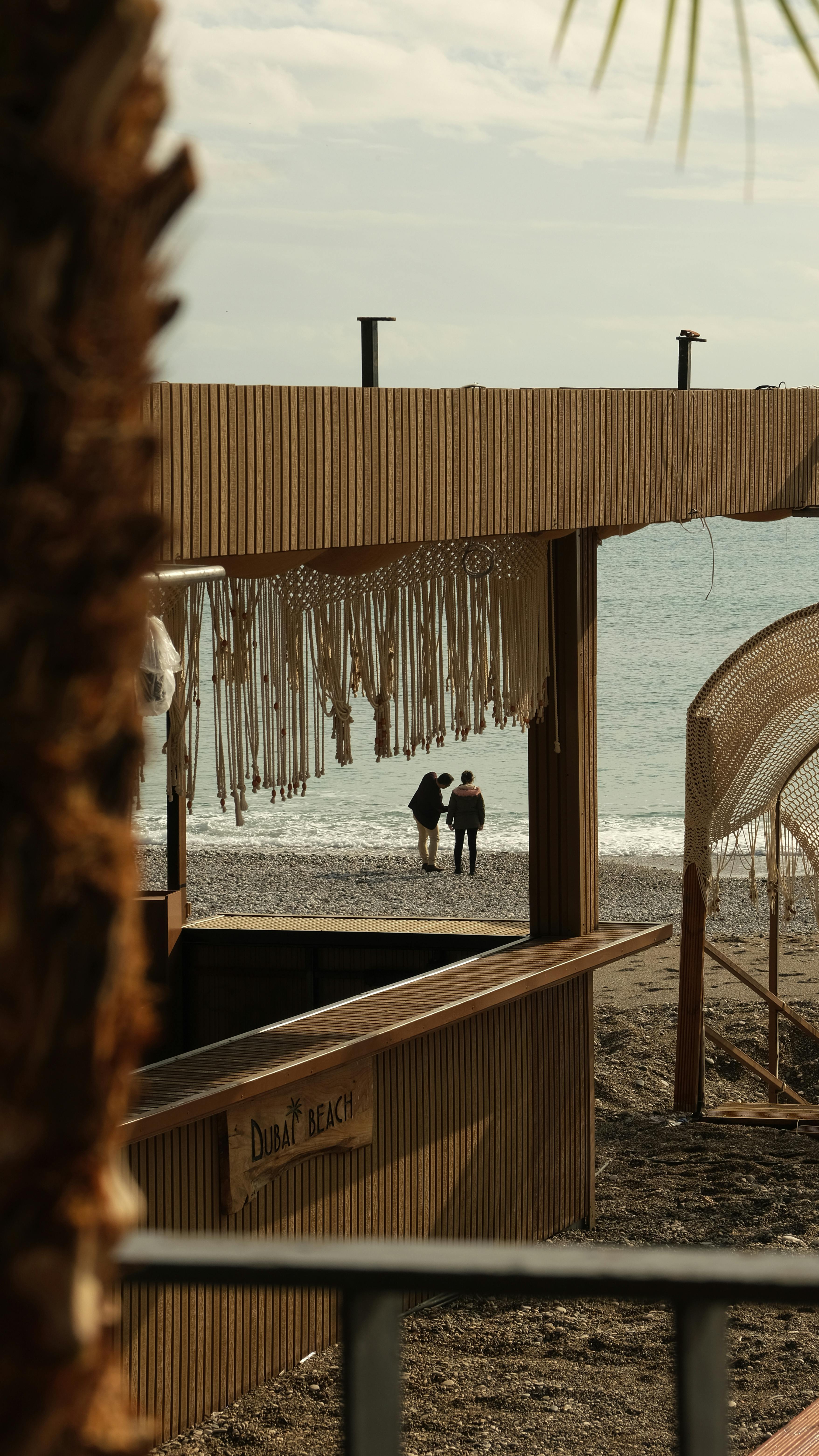 Beachfront View with Rustic Architecture · Free Stock Photo
