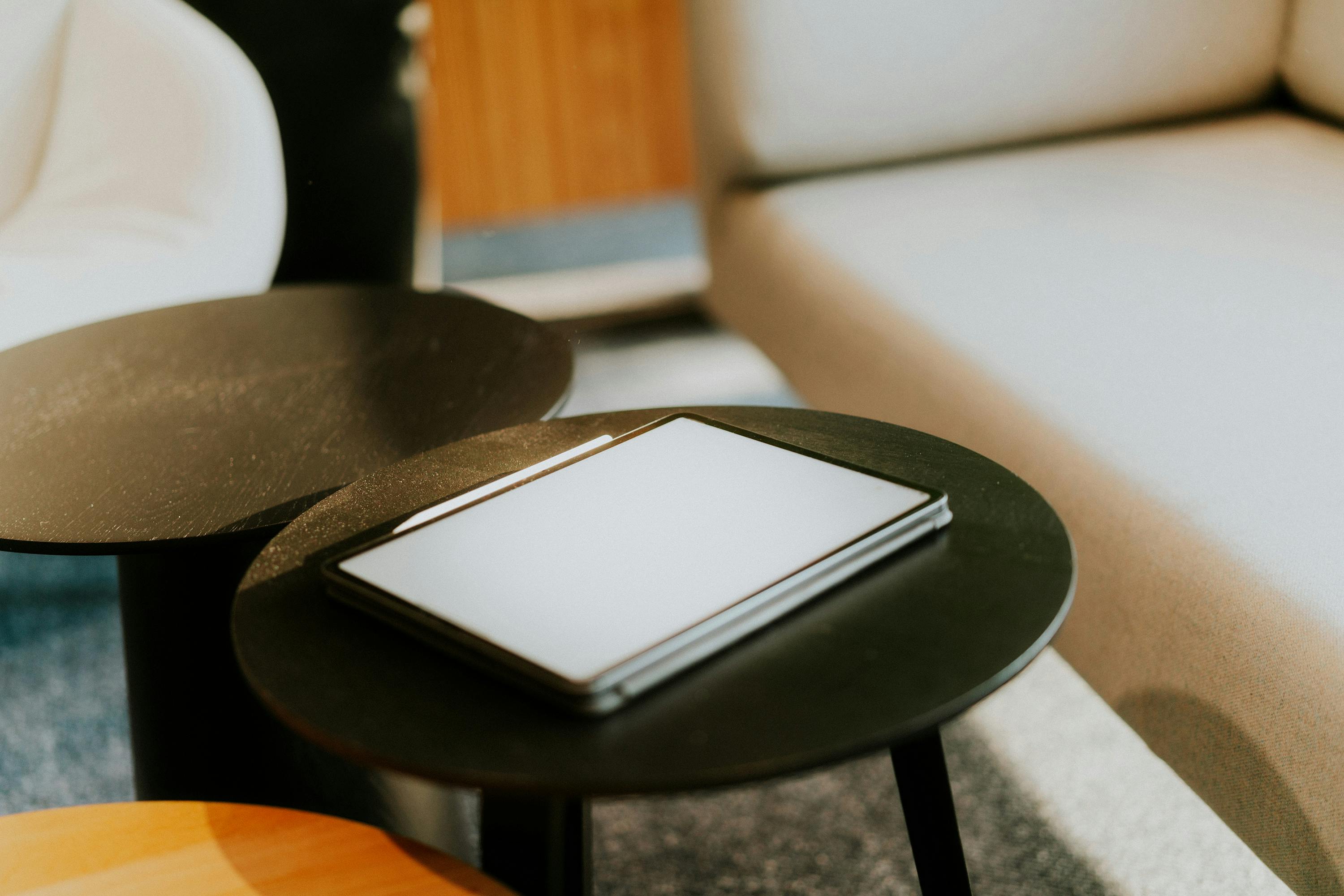Digital Tablet on Minimalist Black Table in Modern Setting · Free Stock ...