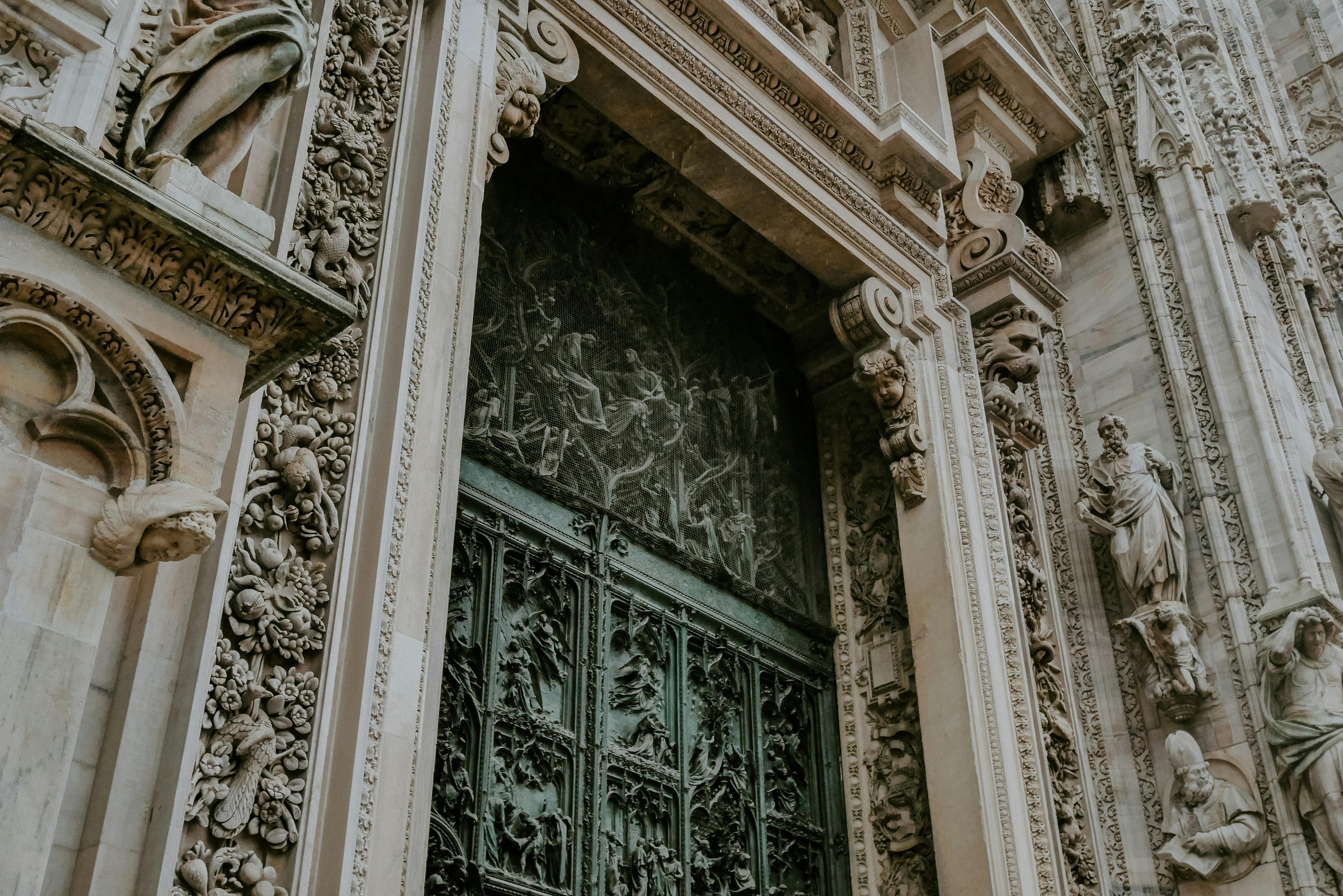 Detailed Gothic Cathedral Entrance with Statues · Free Stock Photo