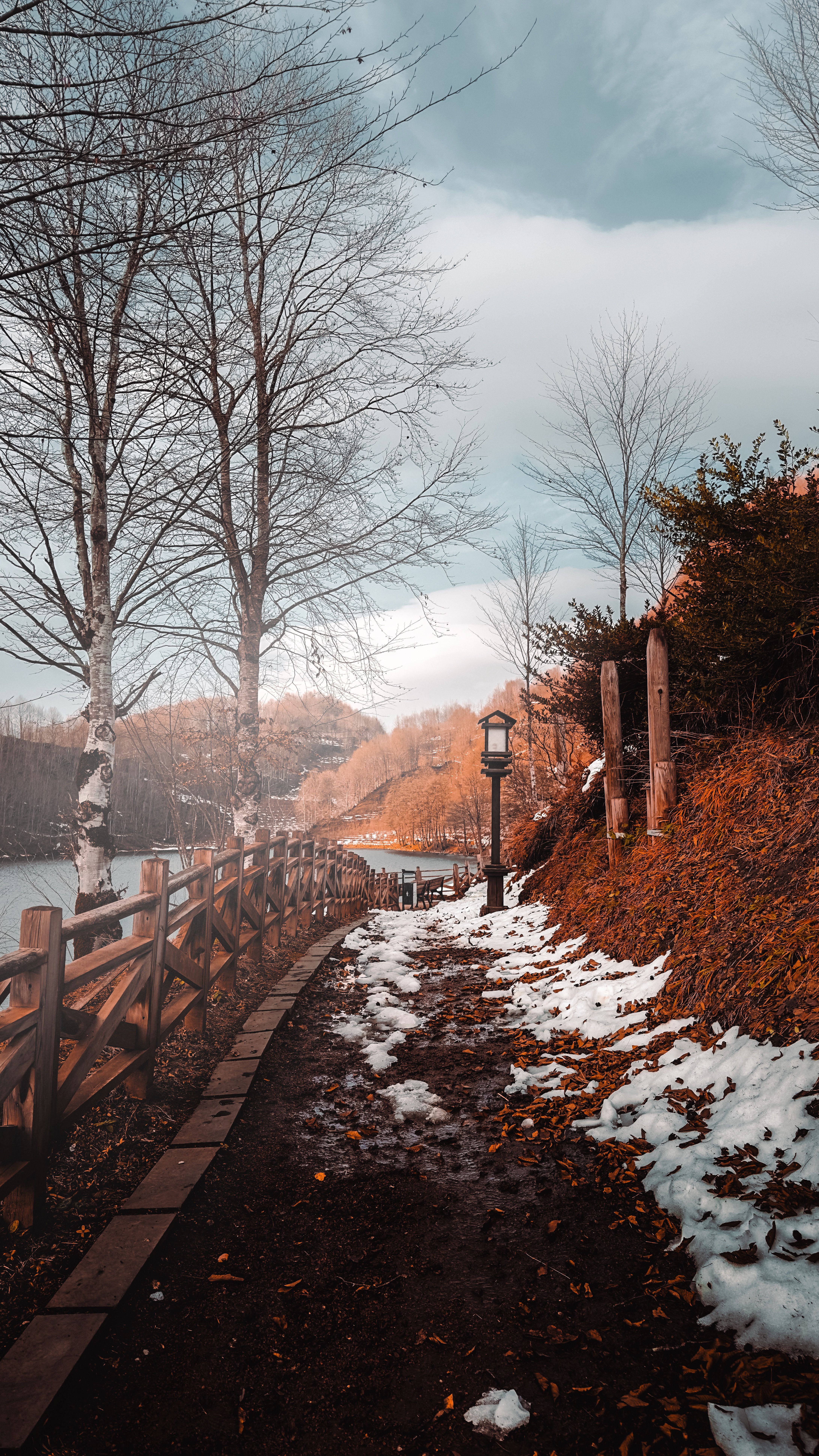 Scenic Fall Pathway with Melting Snow by River · Free Stock Photo